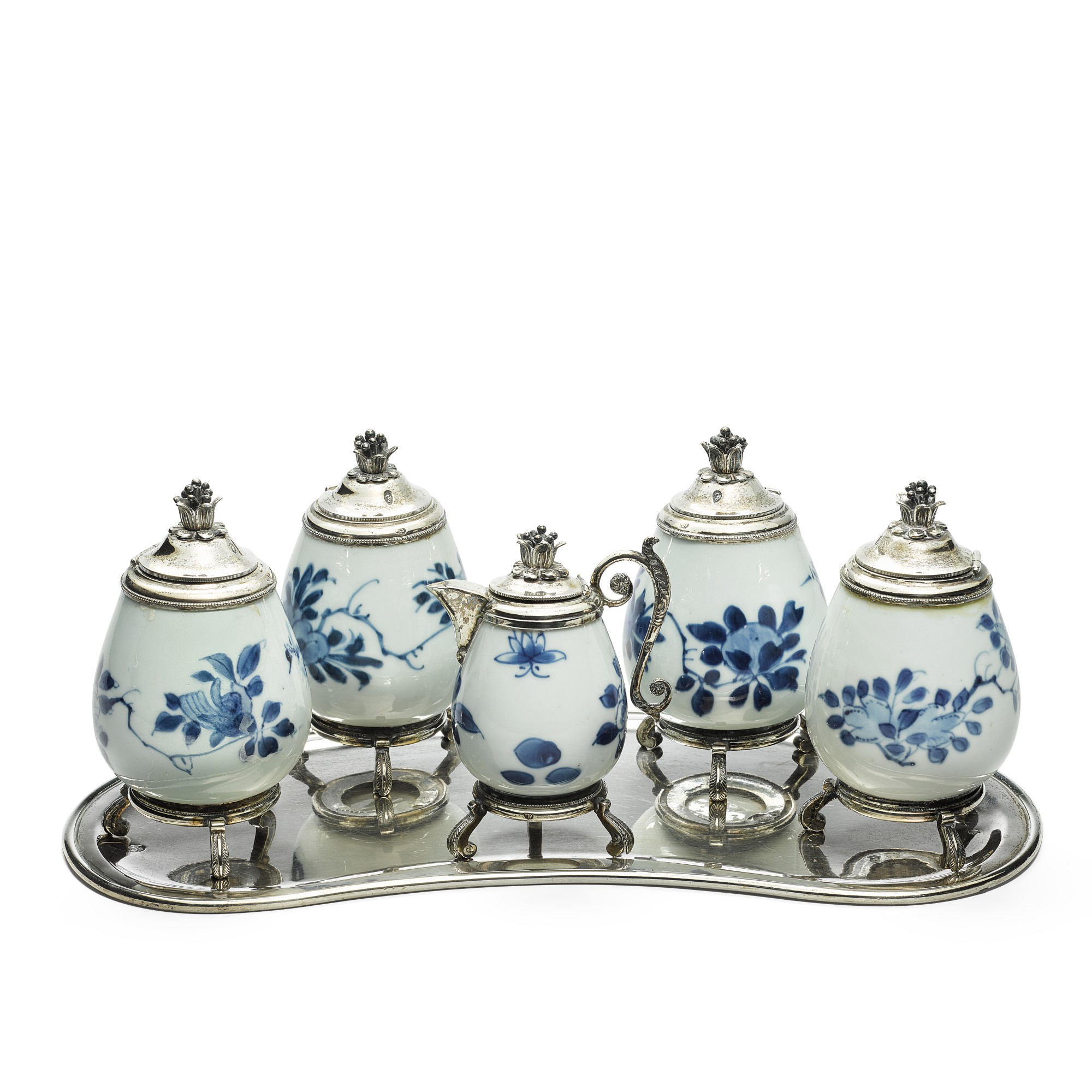 A porcelain condiment set, with silver mounts with the tughra of Sultan ...