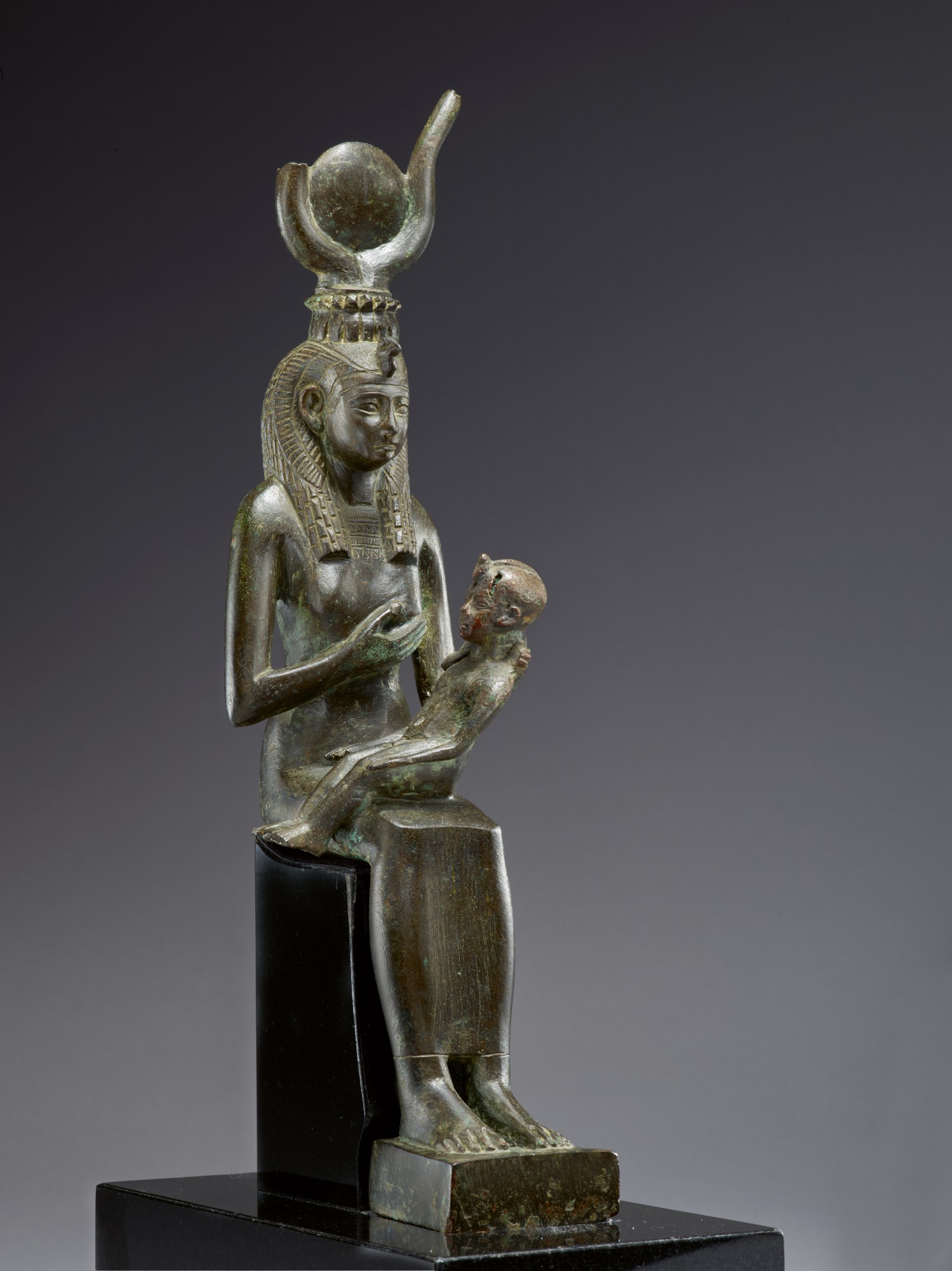 An Egyptian Bronze Figure of Isis with Horus, 26th Dynasty, 664-525 B.C ...
