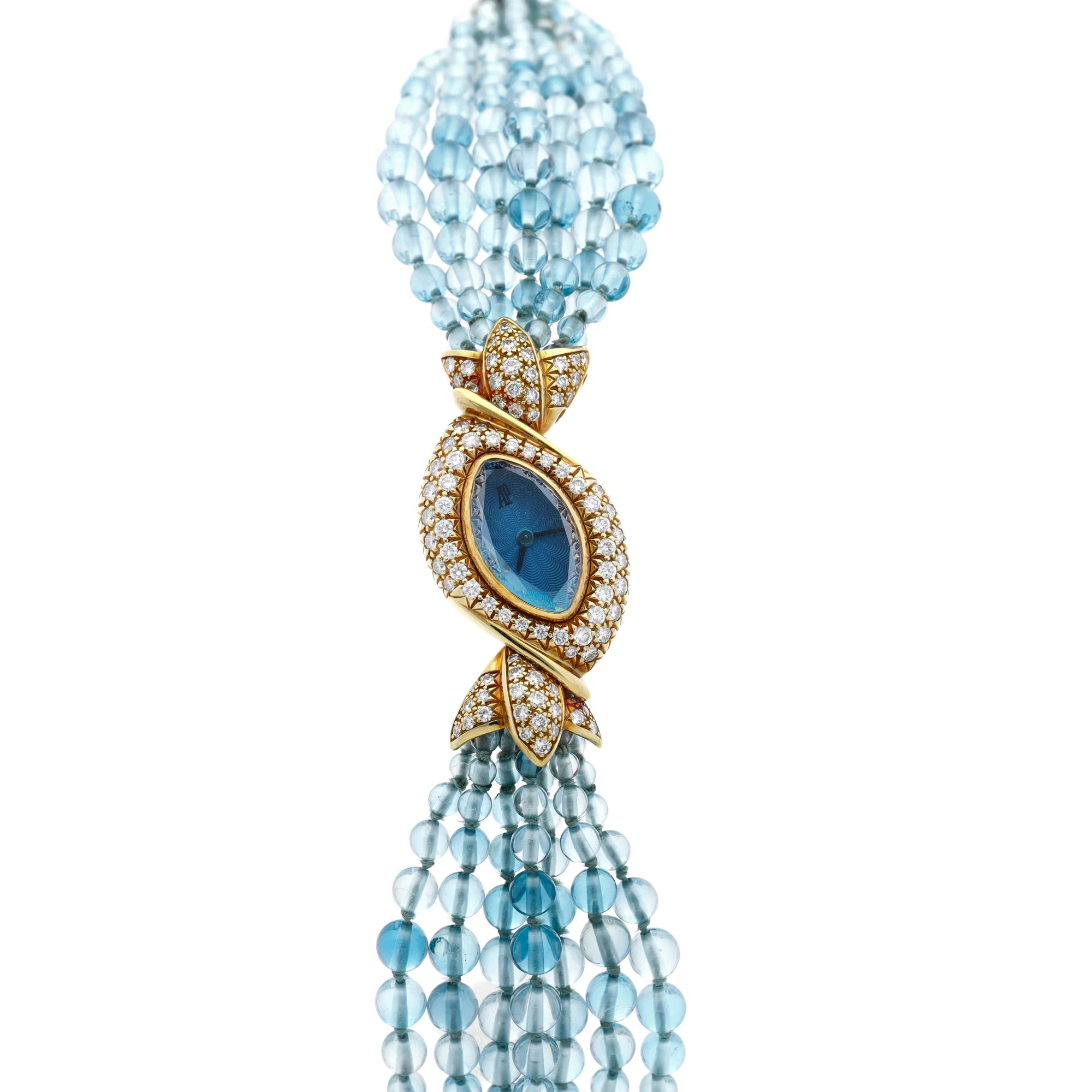 A yellow gold and diamond-set watch with blue topaz beads bracelet ...