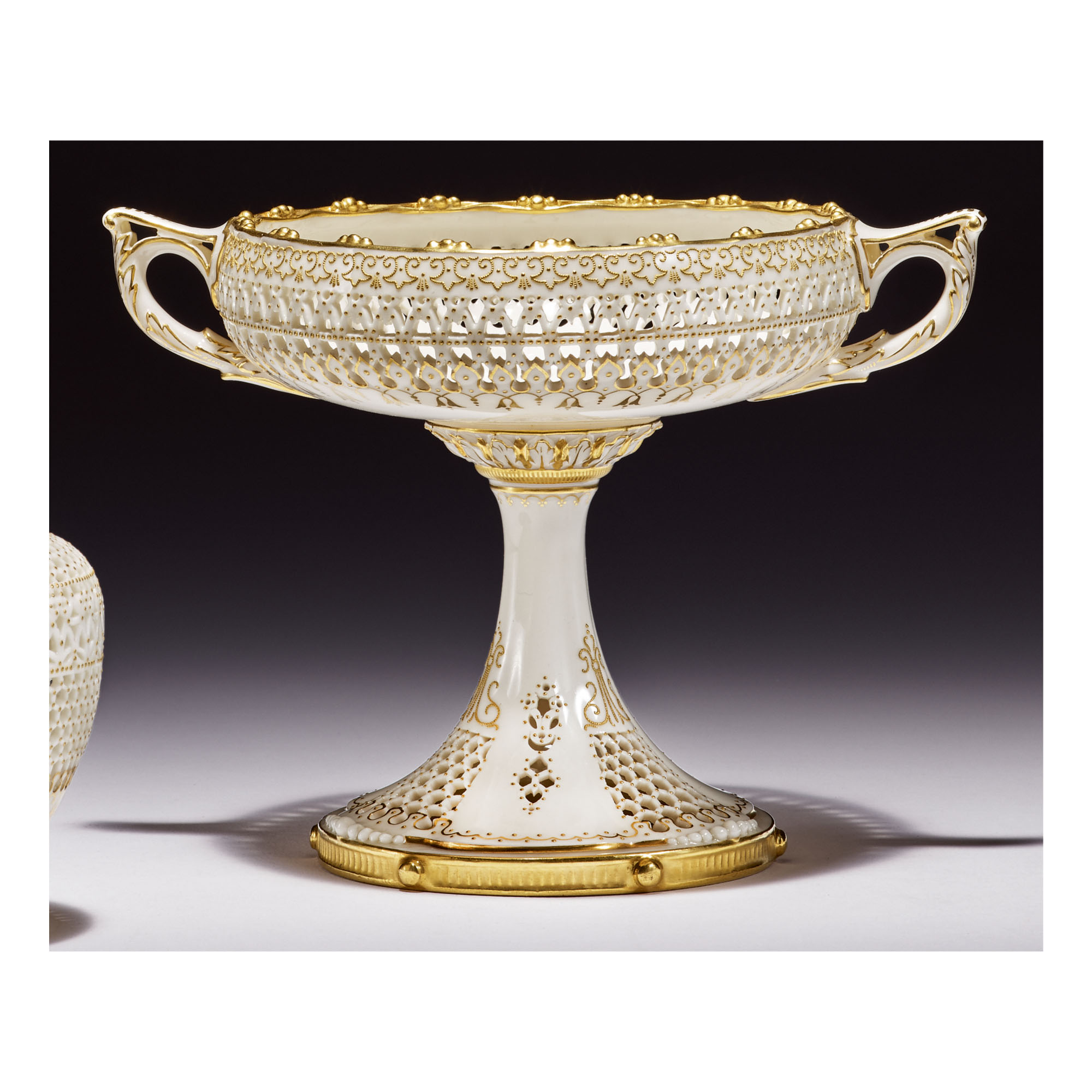 A ROYAL WORCESTER RETICULATED PORCELAIN TWO-HANDLED TAZZA 1910 OR 1911 ...
