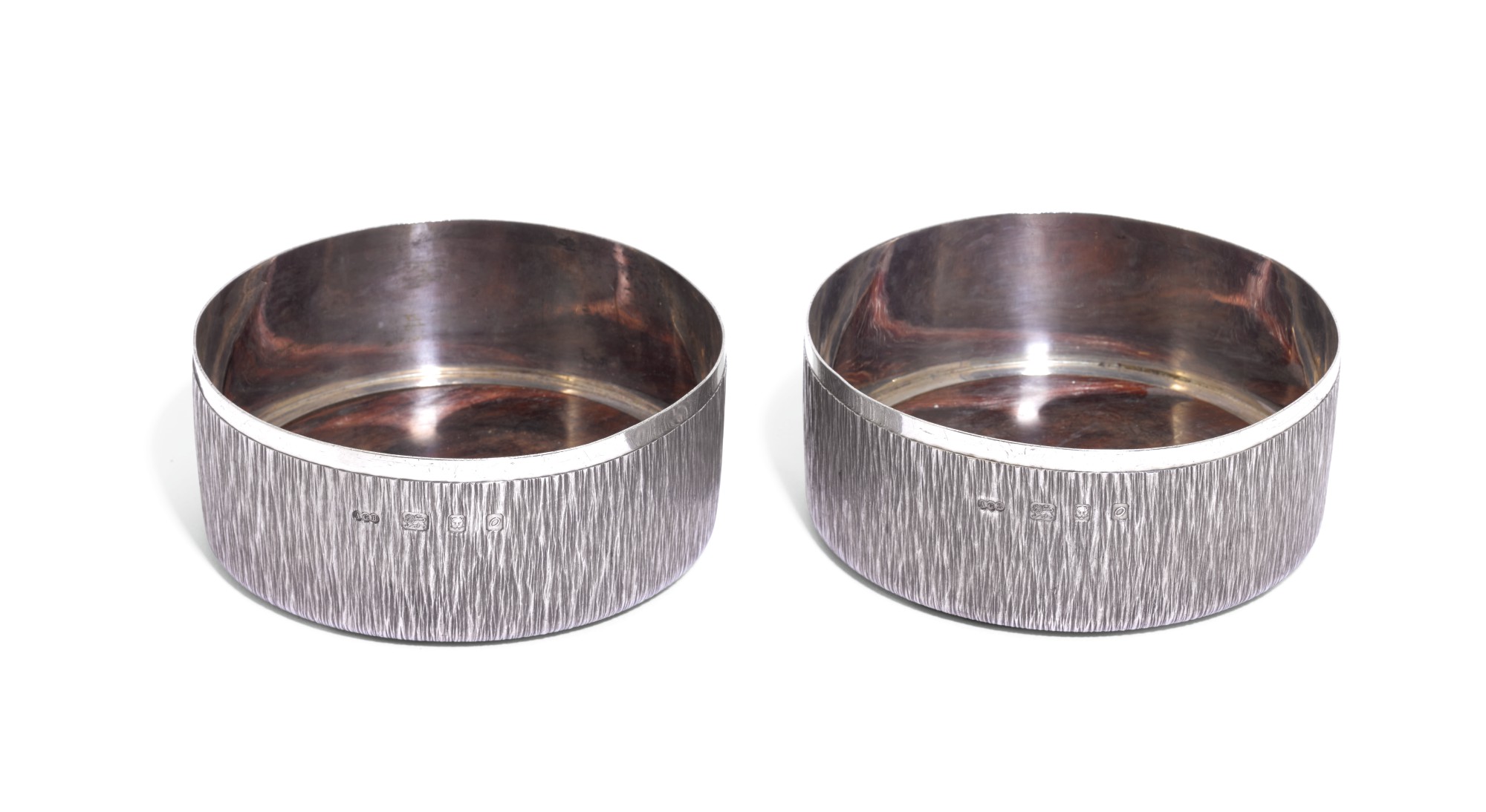 A pair of Elizabeth II silver wine coasters, Gerald Benney, London ...