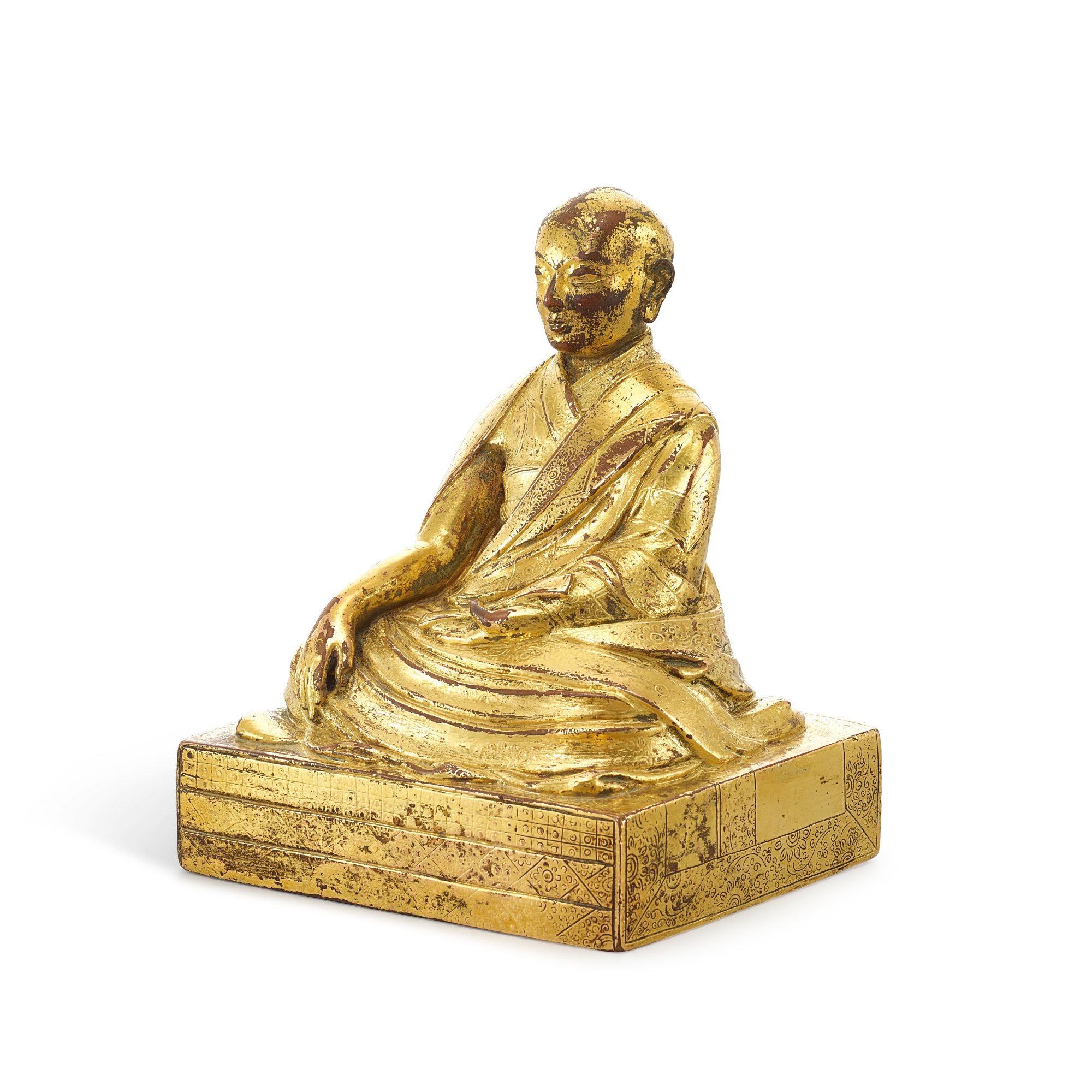 A gilt-bronze figure of a lama, Tibet, 18th century 十八世紀 藏傳鎏金銅喇嘛坐像 ...