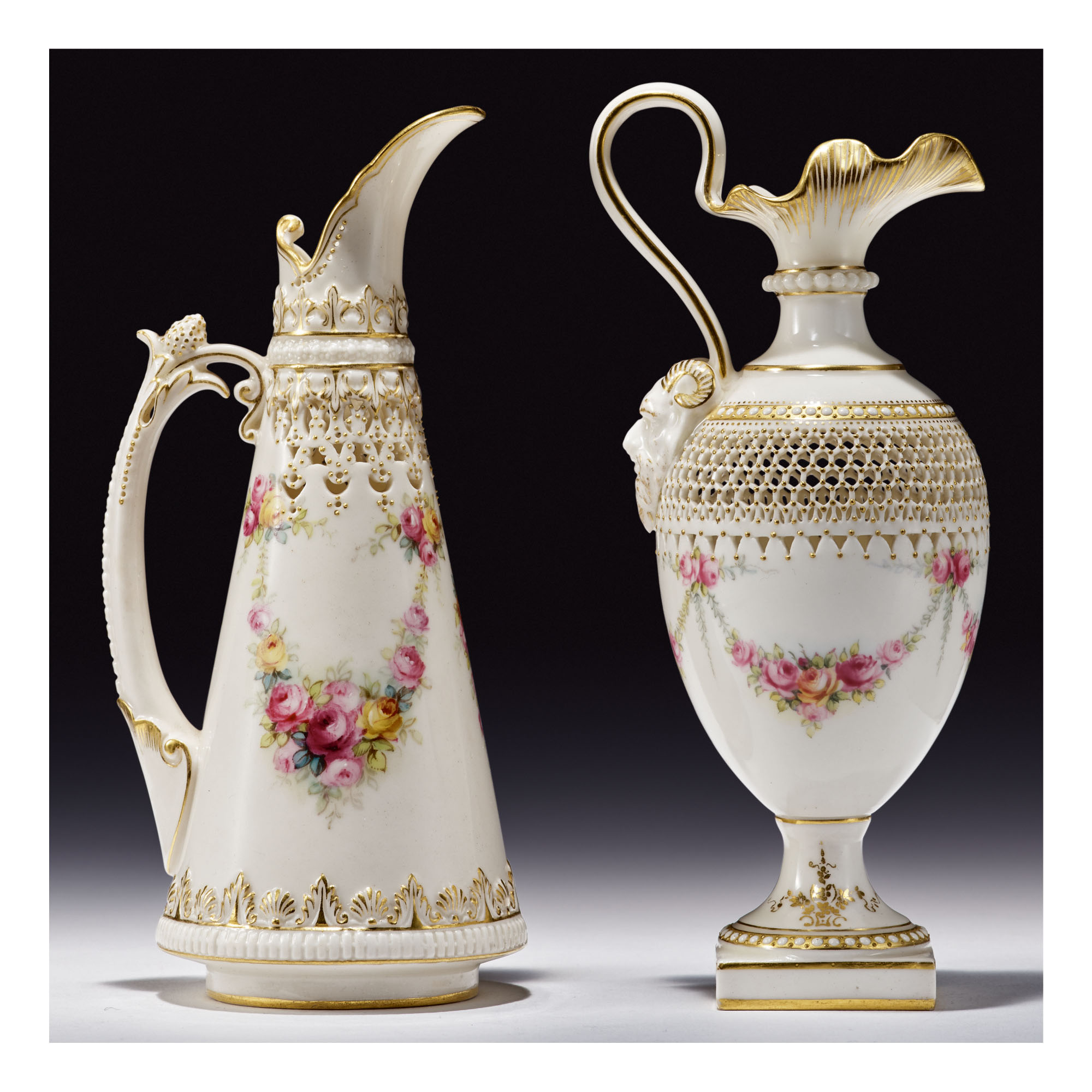 TWO ROYAL WORCESTER PORCELAIN RETICULATED EWERS BY GEORGE OWEN, PAINTED ...