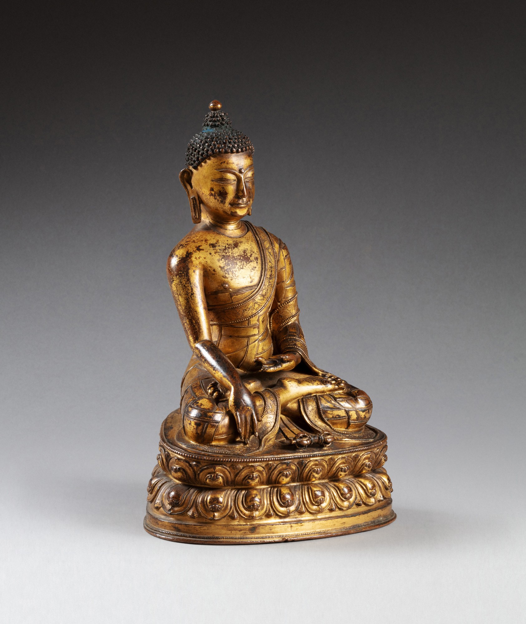 A gilt-copper alloy figure of a Buddha Tibet, 15th-16th century | 西藏 十五 ...