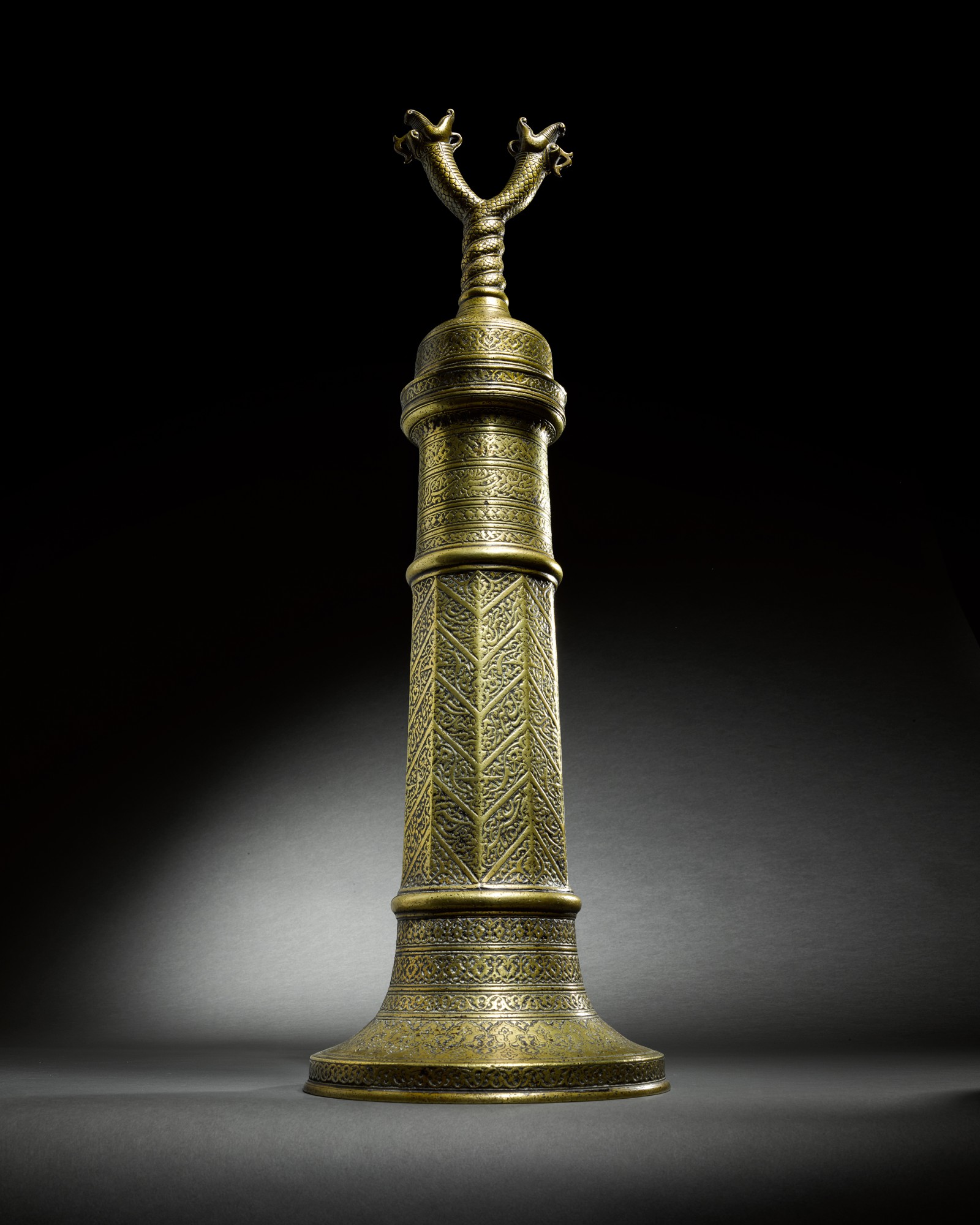 A rare monumental Safavid brass torchstand with cover, Persia, 16th ...