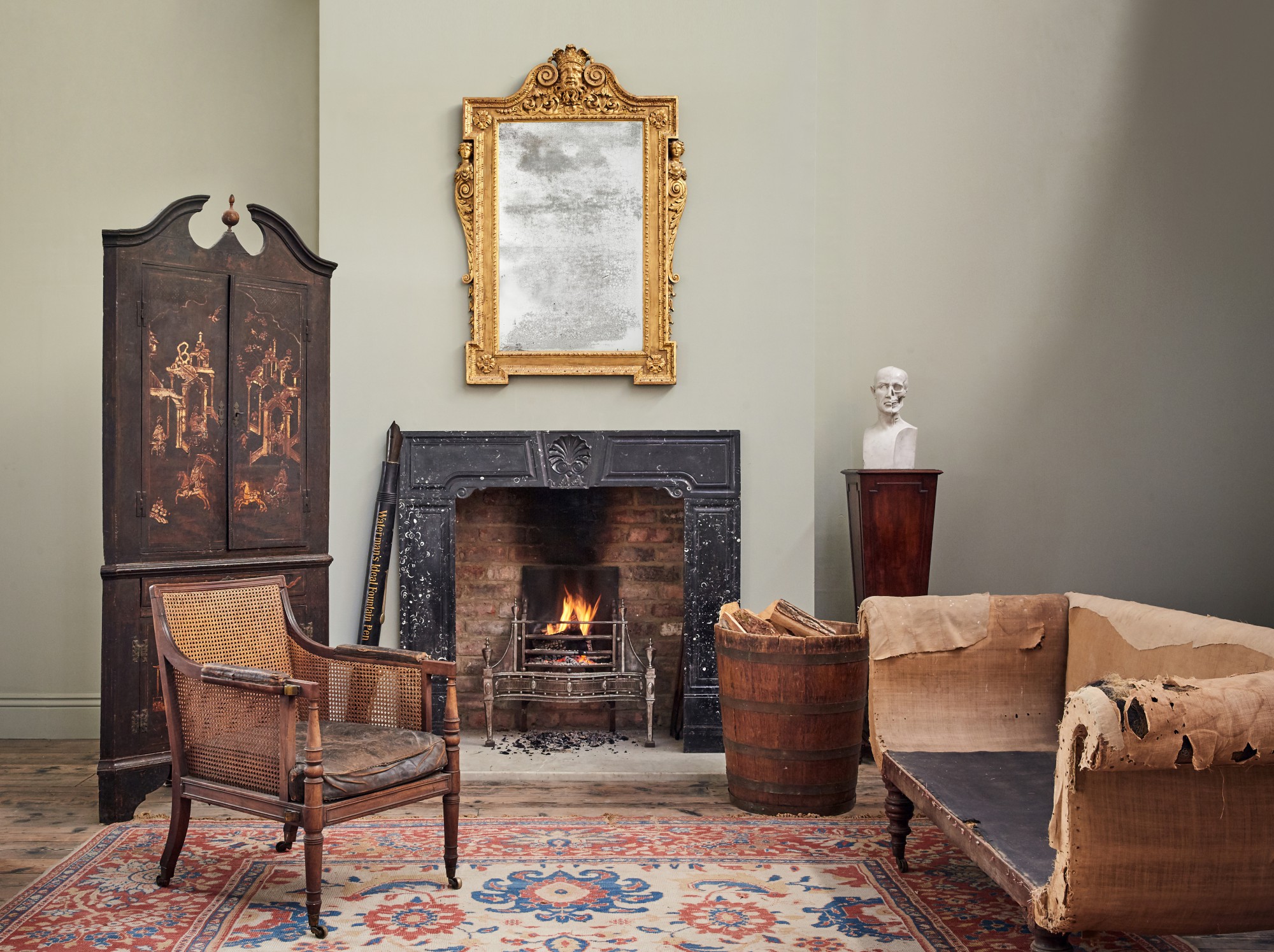 A GEORGE I IRISH KILKENNY MARBLE FIRE SURROUND, EARLY 18TH CENTURY ...