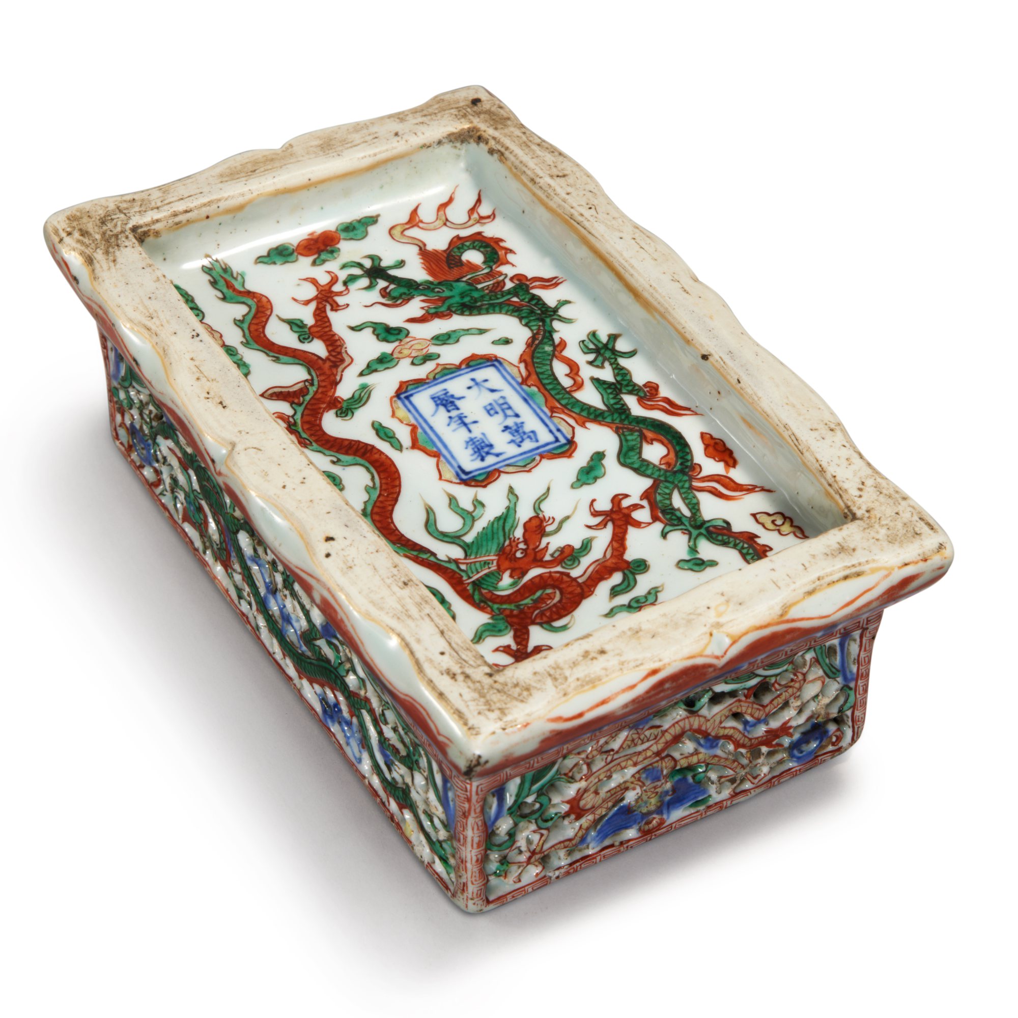 A rare wucai 'dragon' rectangular inkstone, Mark and period of Wanli ...