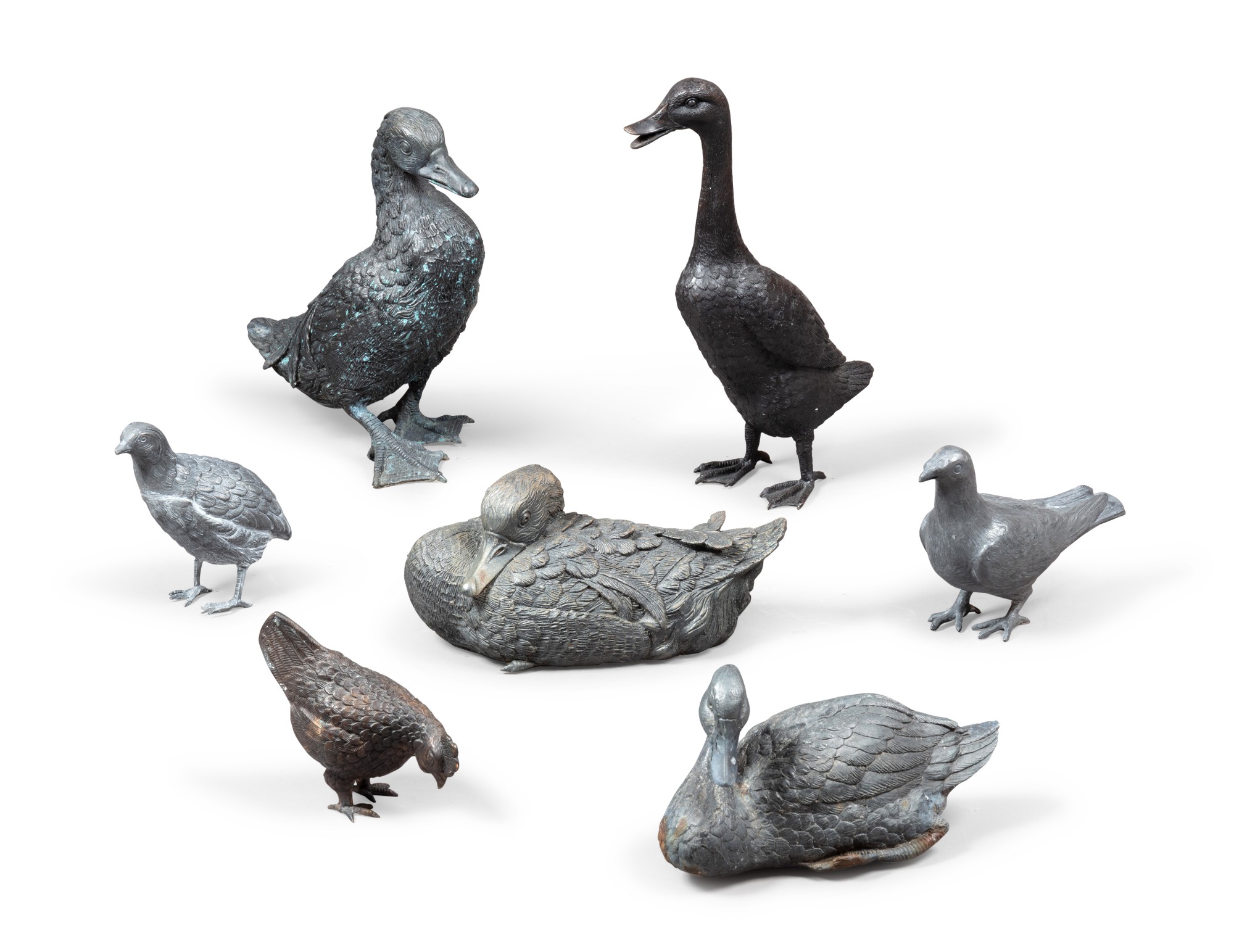 A group of seven decorative metal birds metal, including a tin bird ...