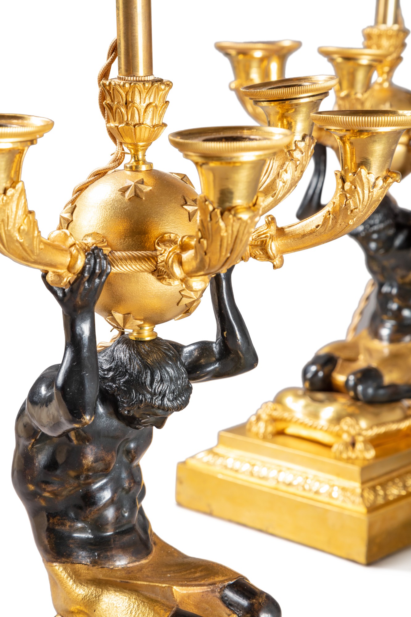 A pair of gilt and patinated bronze four-light candelabra, 19th century ...