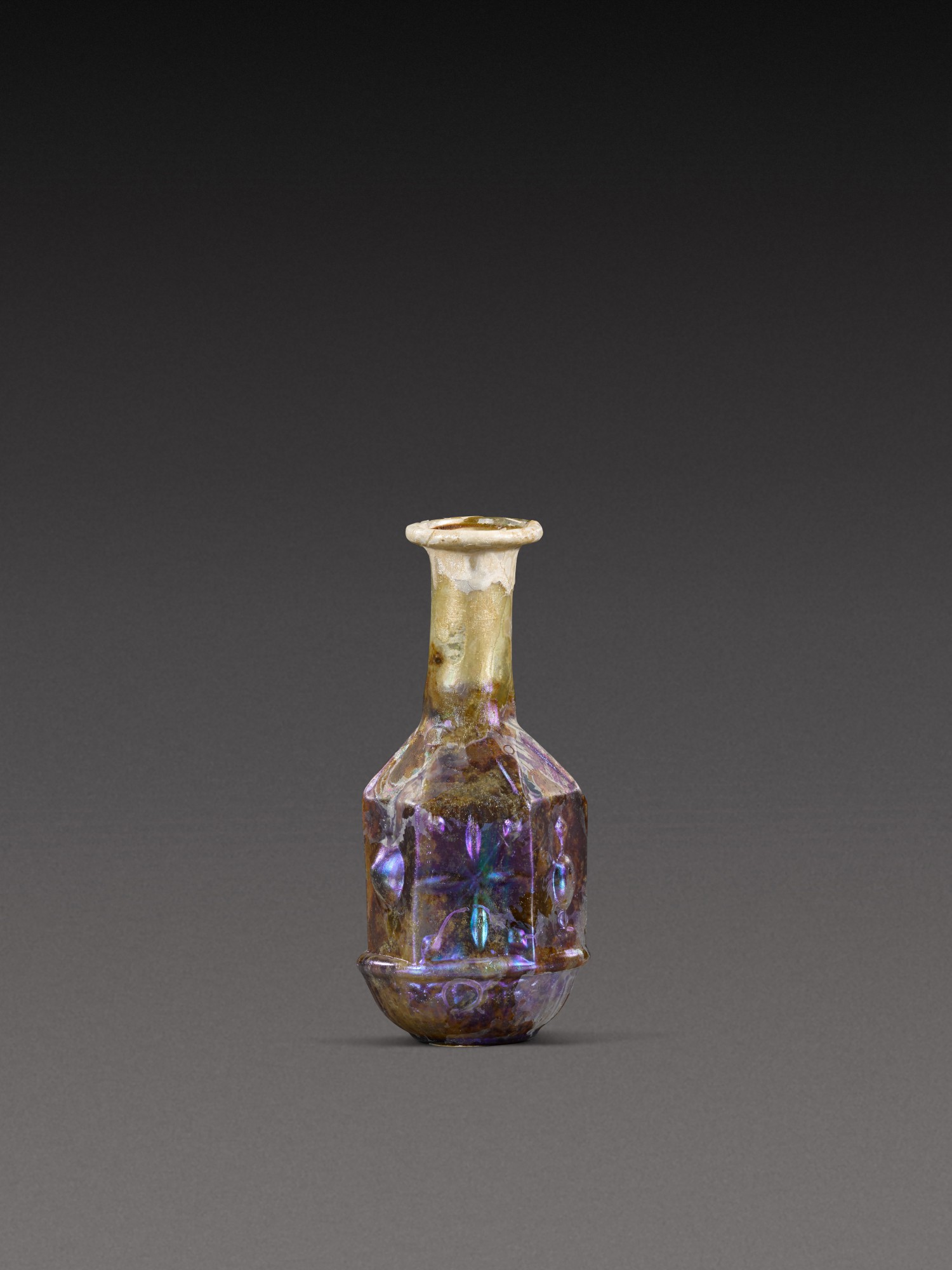 A Roman Opaque Mould-Blown Hexagonal Glass Flask, circa 1st Century A.D ...