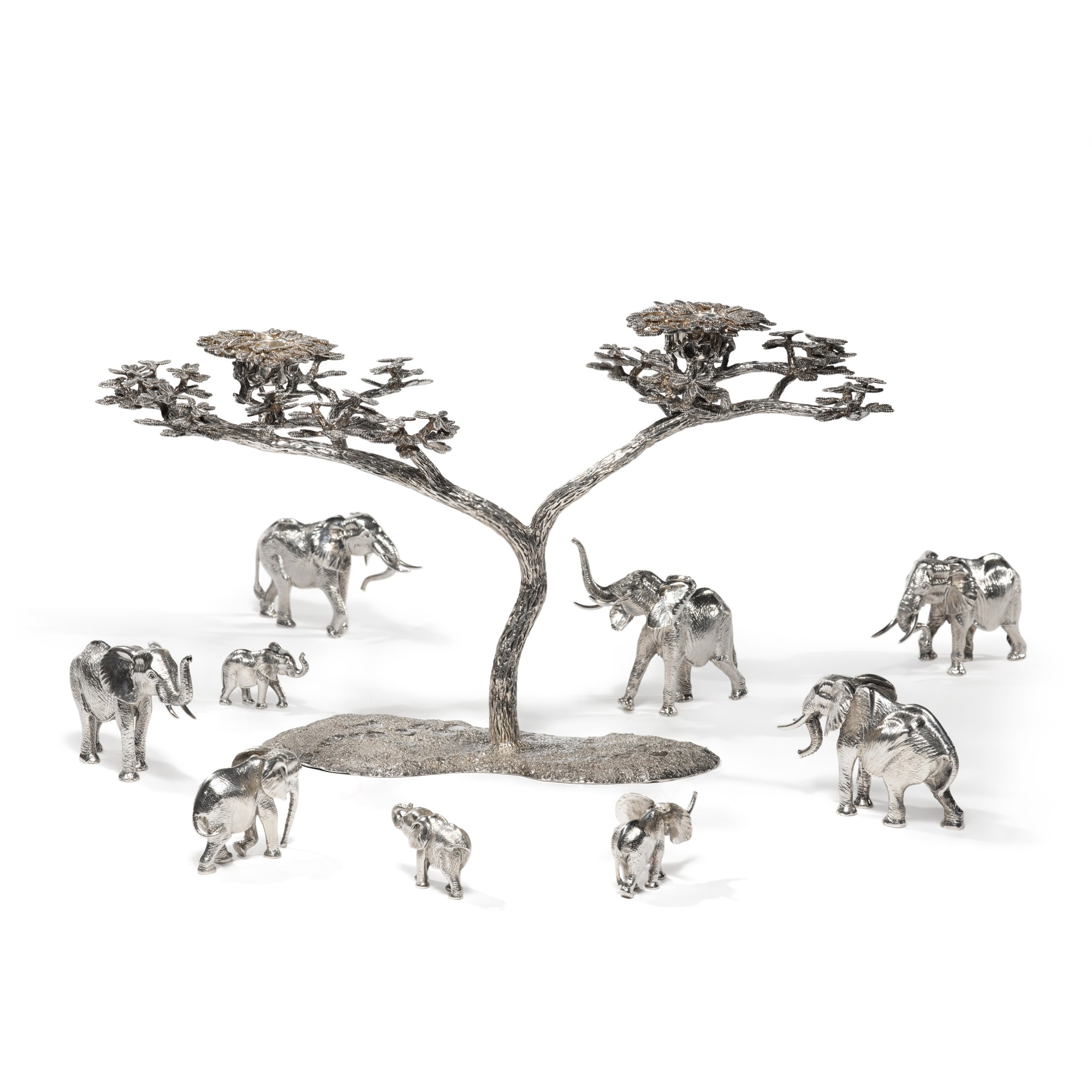 A Zimbabwean Silver Acacia Tree Two-Light Candelabrum and Nine ...