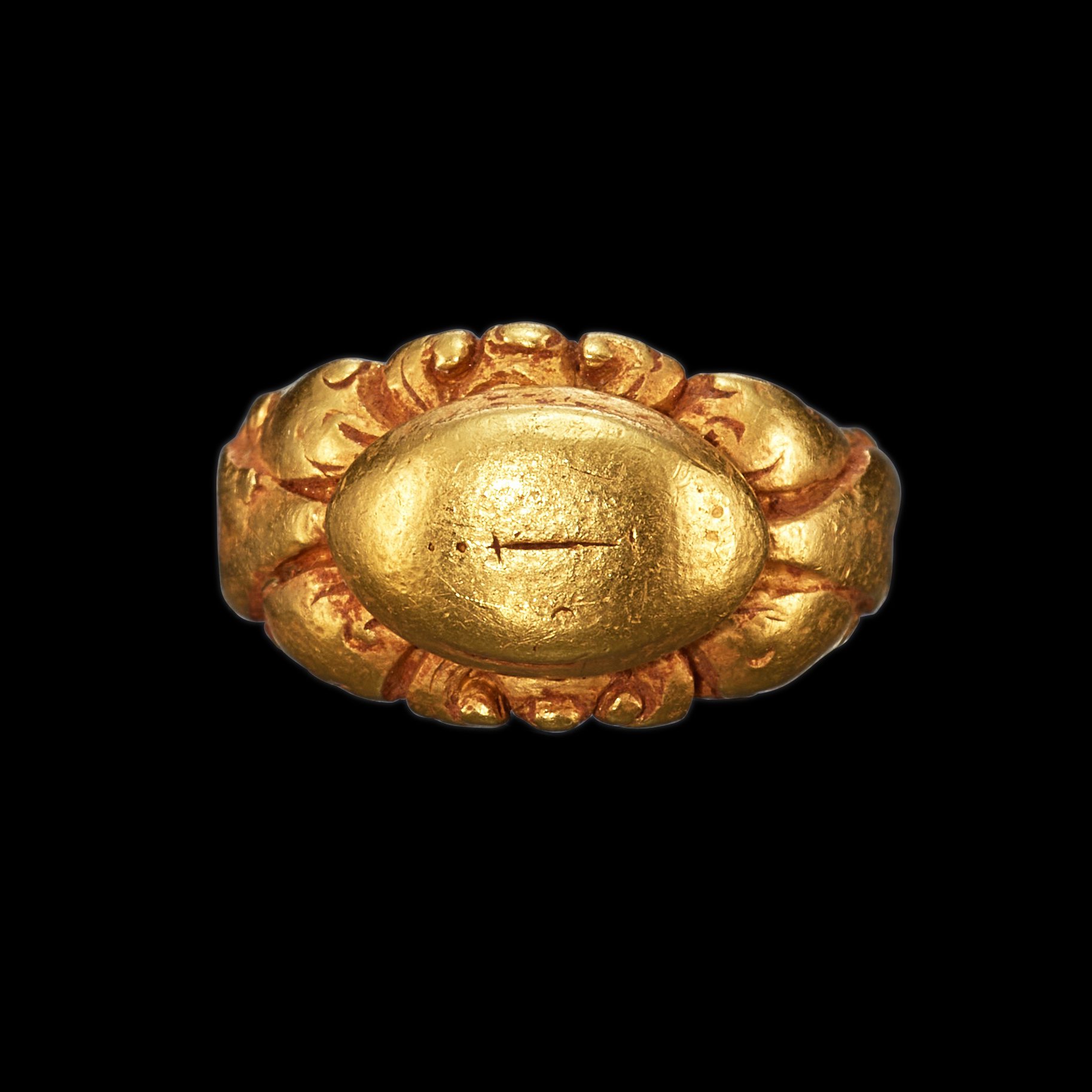 A solid gold ring with floral shank and engraved 'Ankusa' symbol Java ...