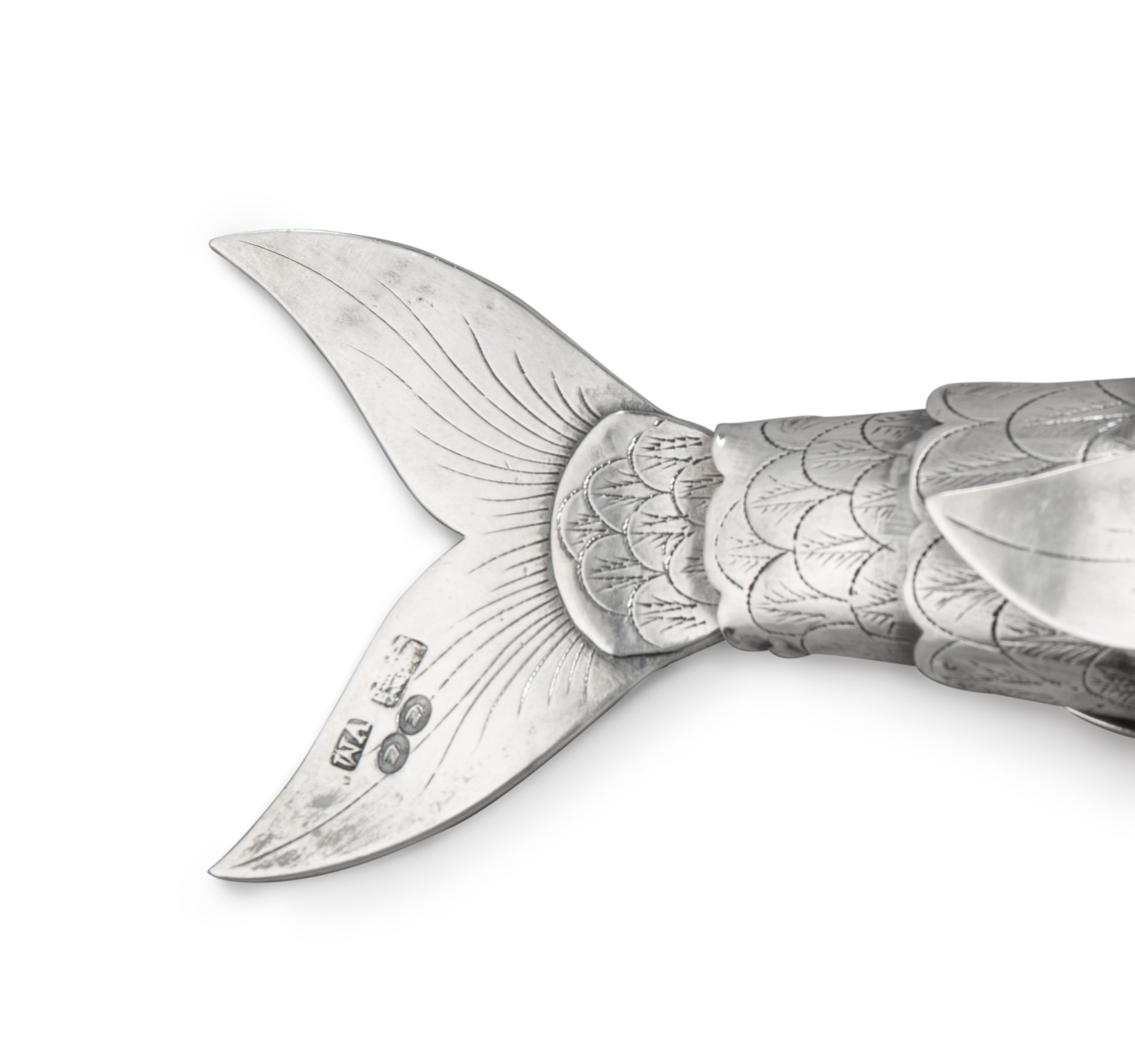 A group of three silver and silver-plated articulated fish, probably ...