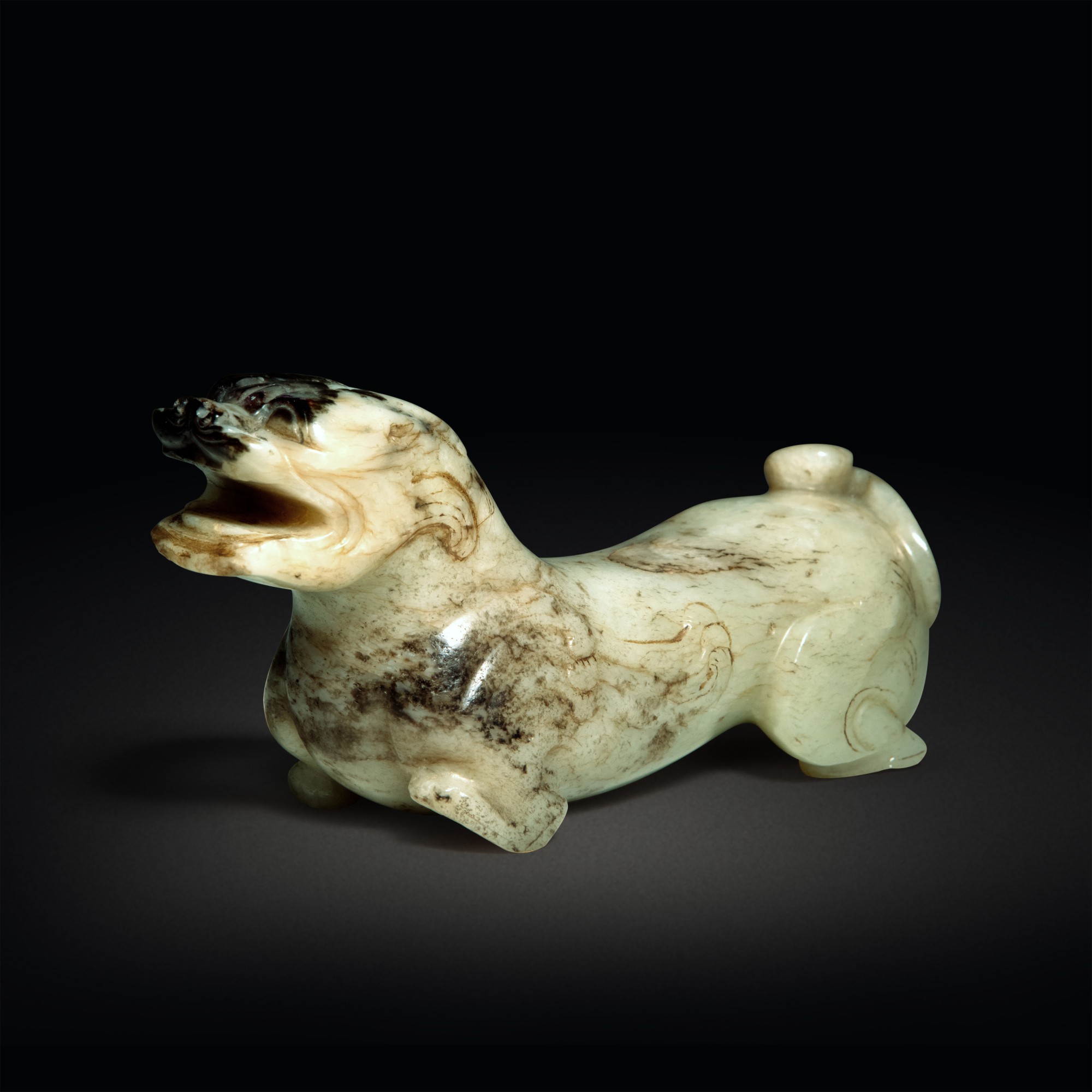 A beige and brown jade figure of a bixie, Ming dynasty or later | 明或以後 ...