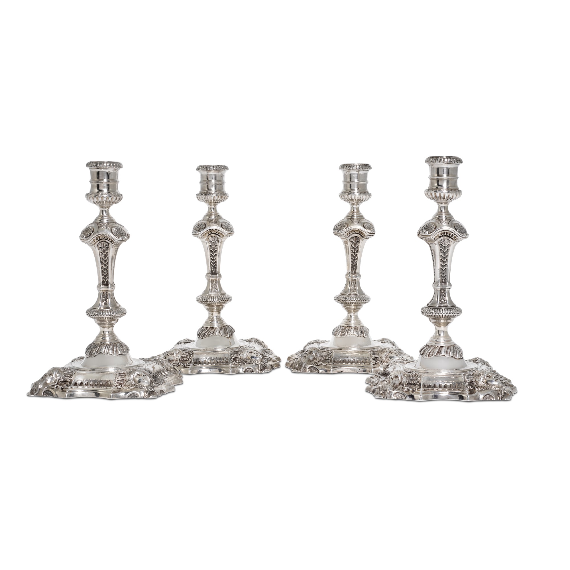 A set of four George II silver table candlesticks, George Wickes ...