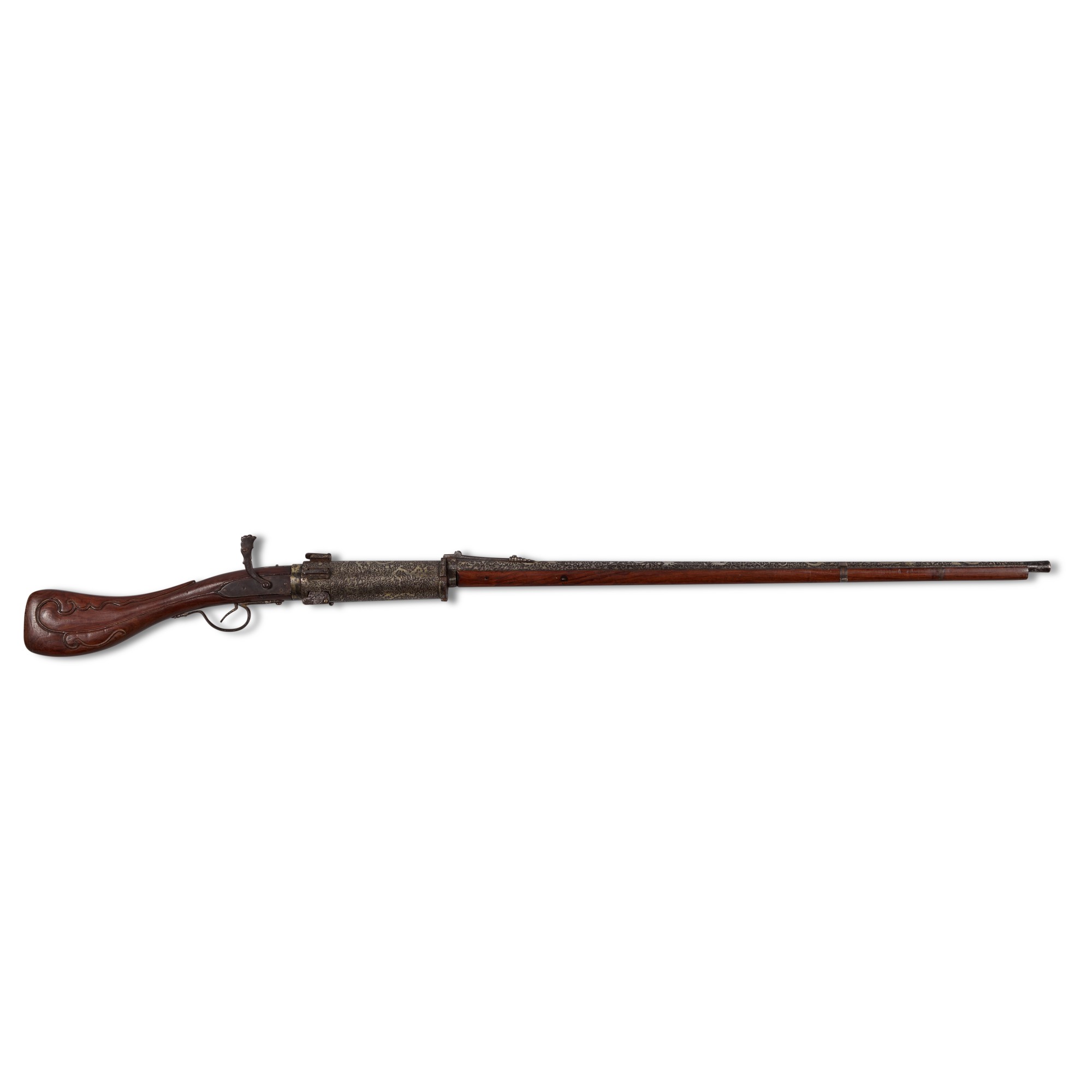 A rare six-barrelled silver damascened matchlock revolving gun, Early ...