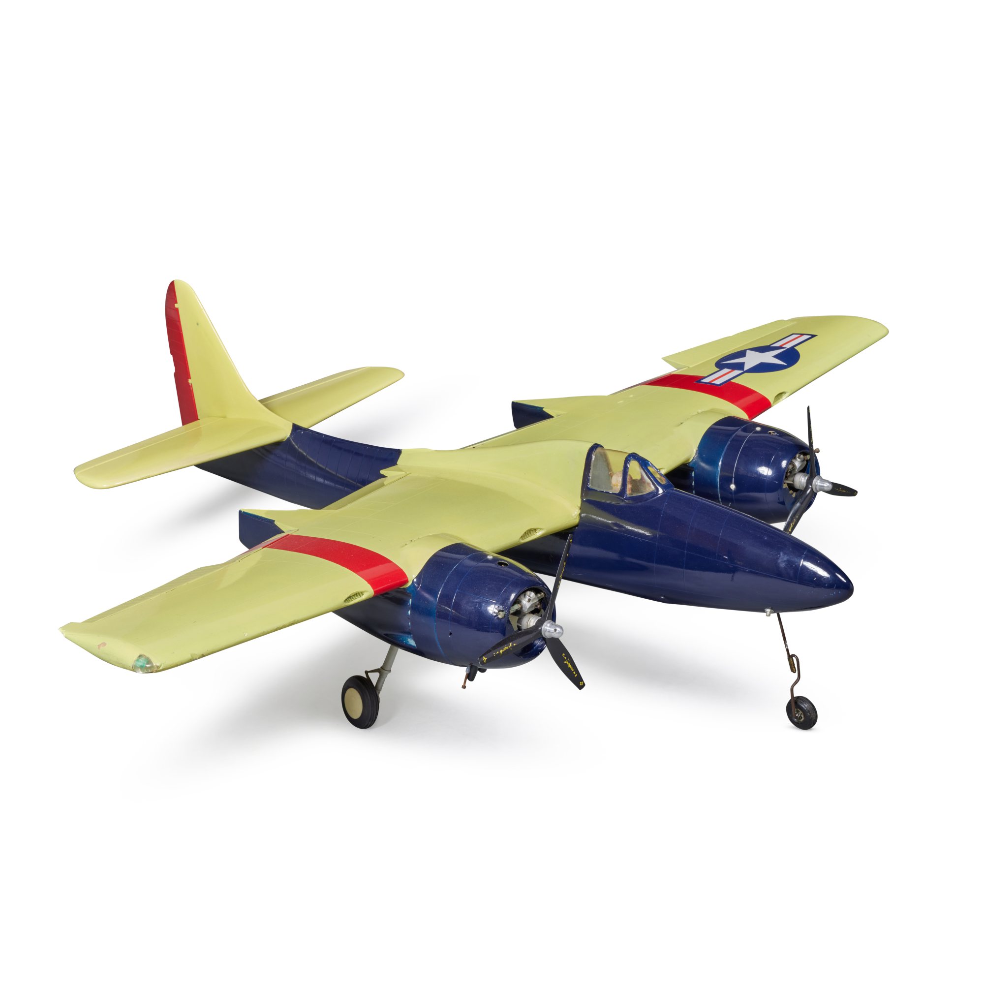 A Model Of A Us F7f Tigercat With Yellow Wings And Blue Body