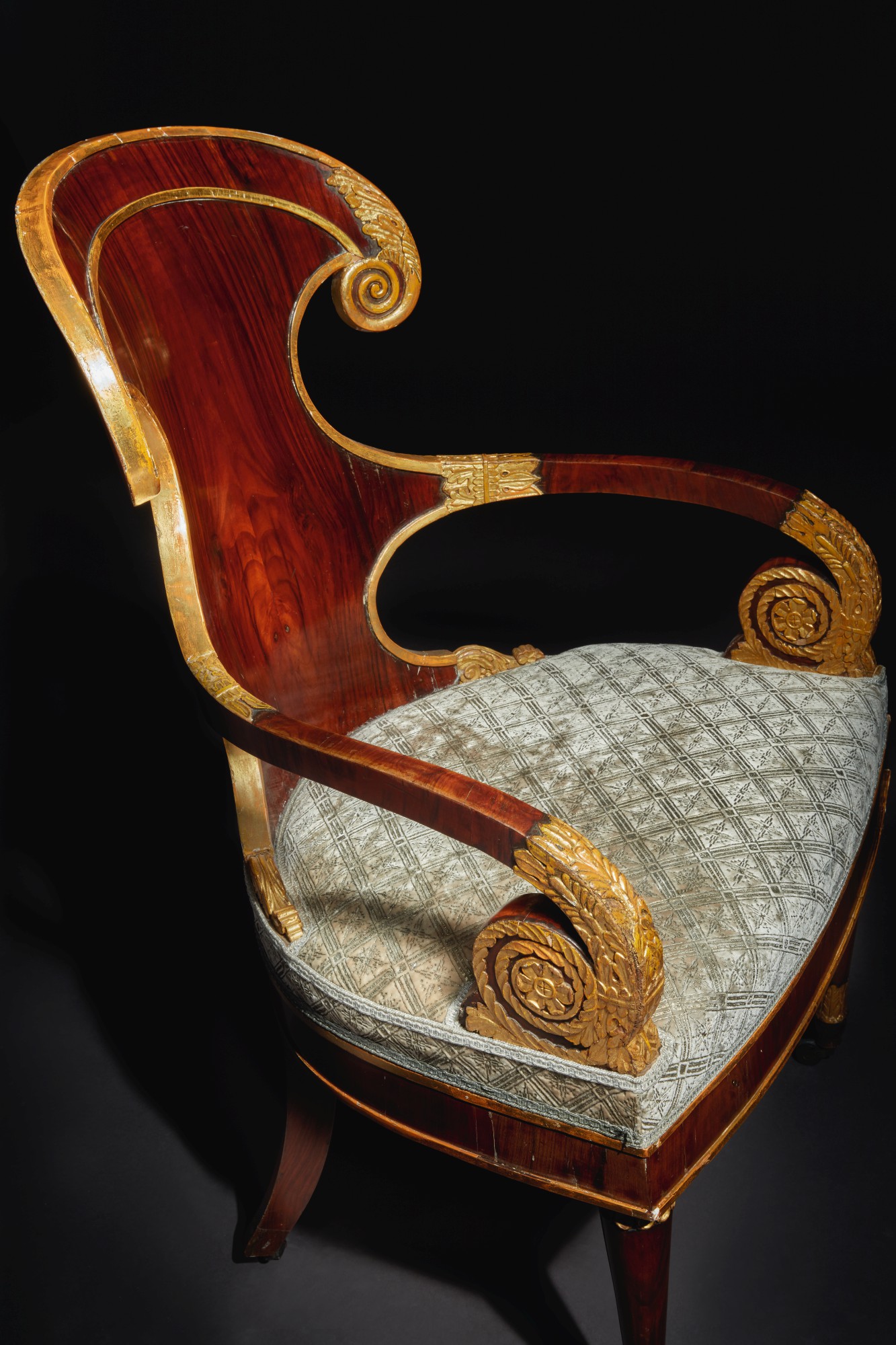 A RUSSIAN NEOCLASSICAL ROSEWOOD AND PARCEL-GILT ARMCHAIR, CIRCA 1825 ...