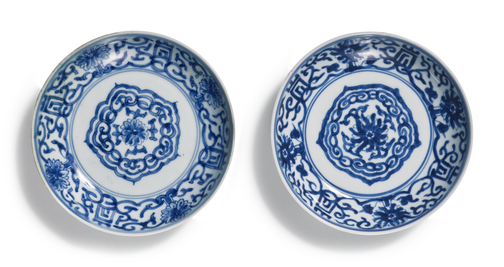 Two blue and white 'shou and lotus' dishes, Qing dynasty, Kangxi period ...