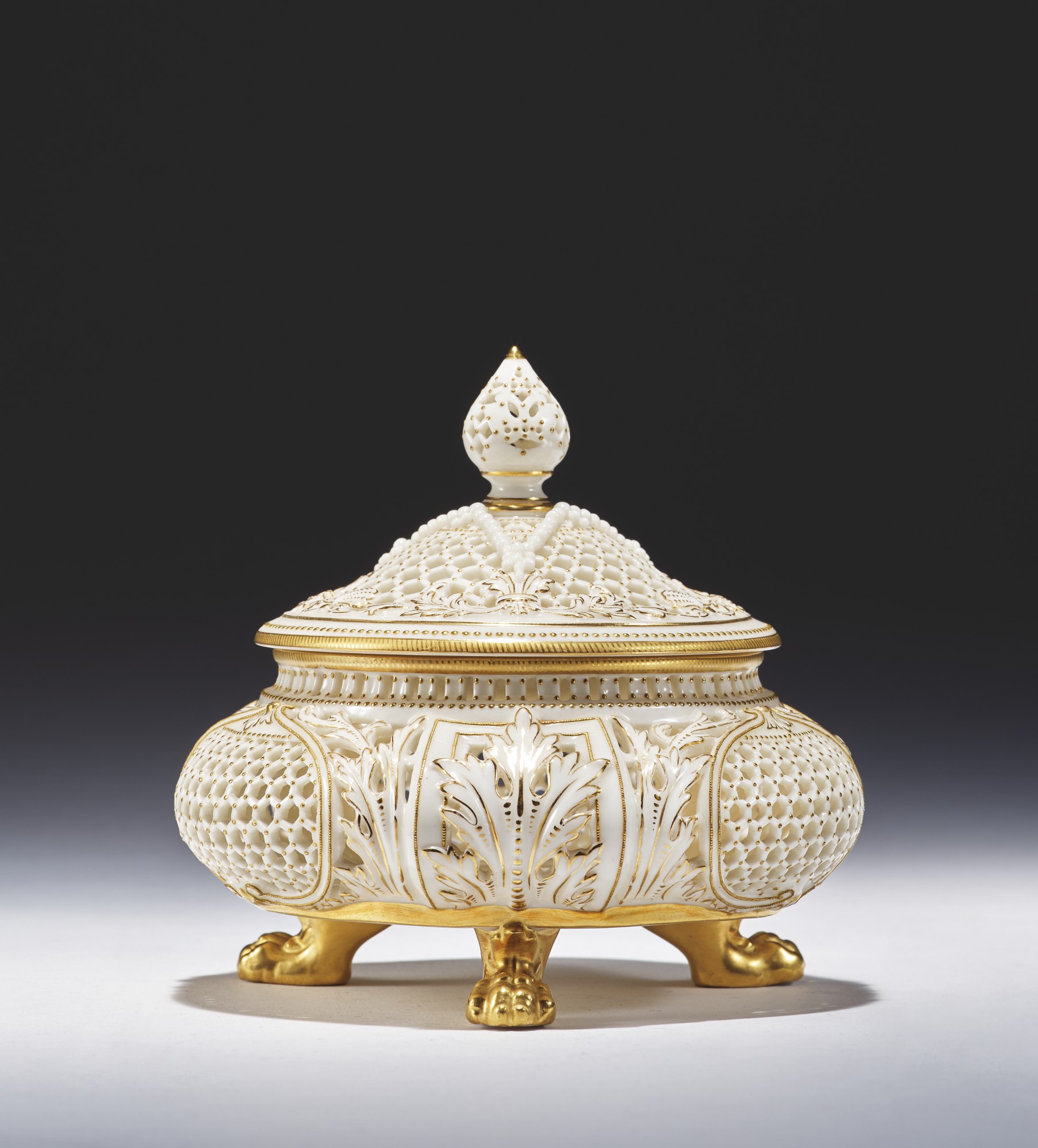 A ROYAL WORCESTER RETICULATED PORCELAIN CIRCULAR BOX AND COVER BY ...