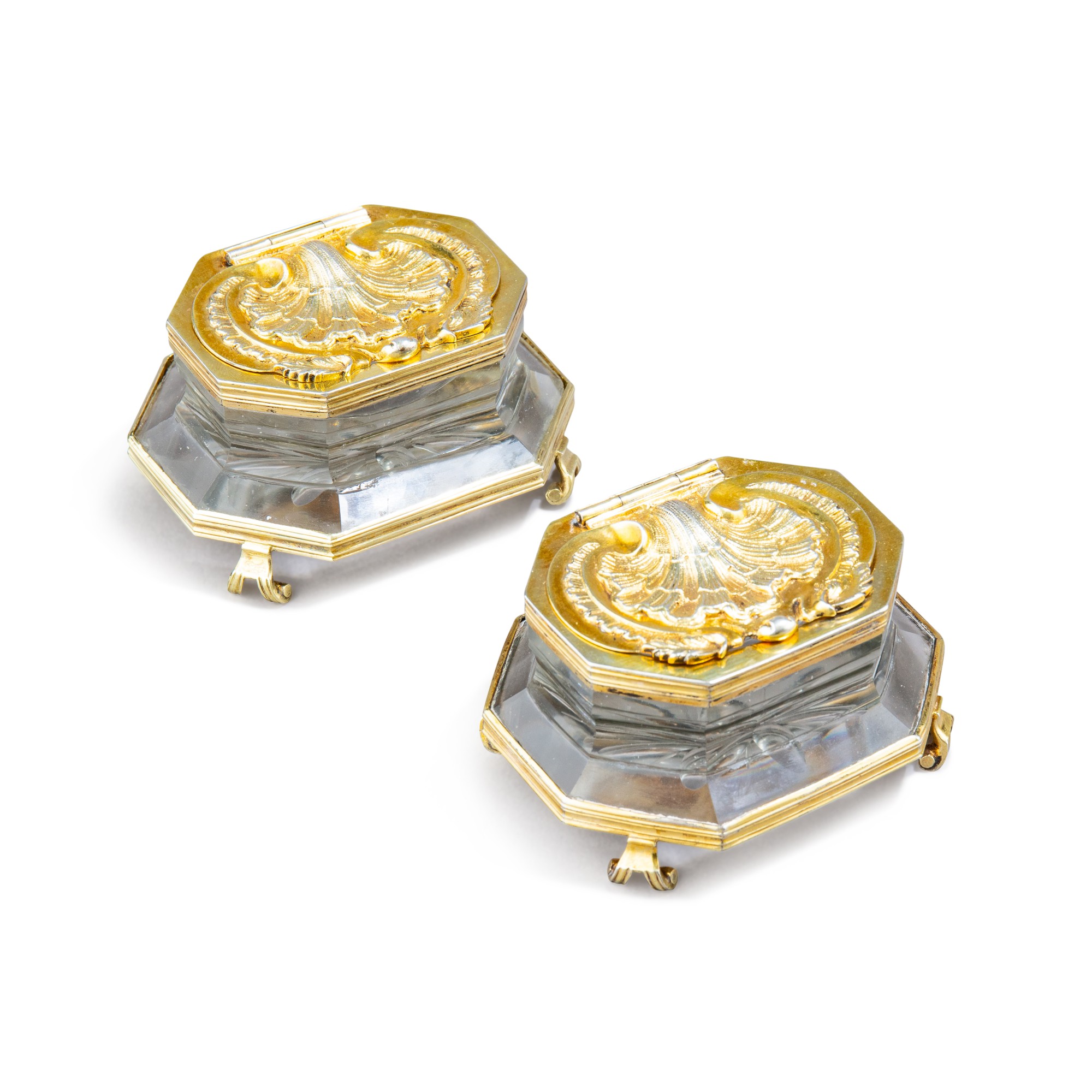A pair of French silver-gilt and rock crystal covered salt-cellars ...
