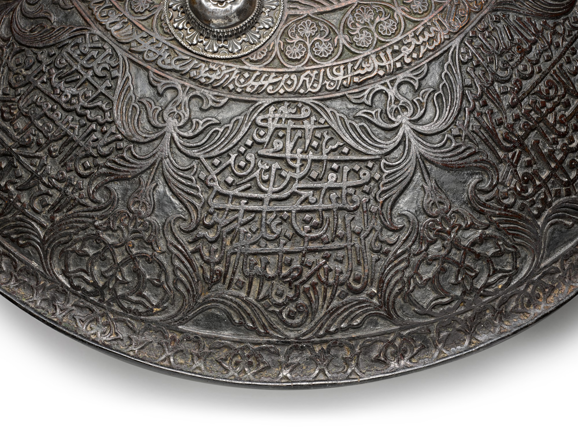 A carved leather shield (dhal) with silver bosses, India, probably ...