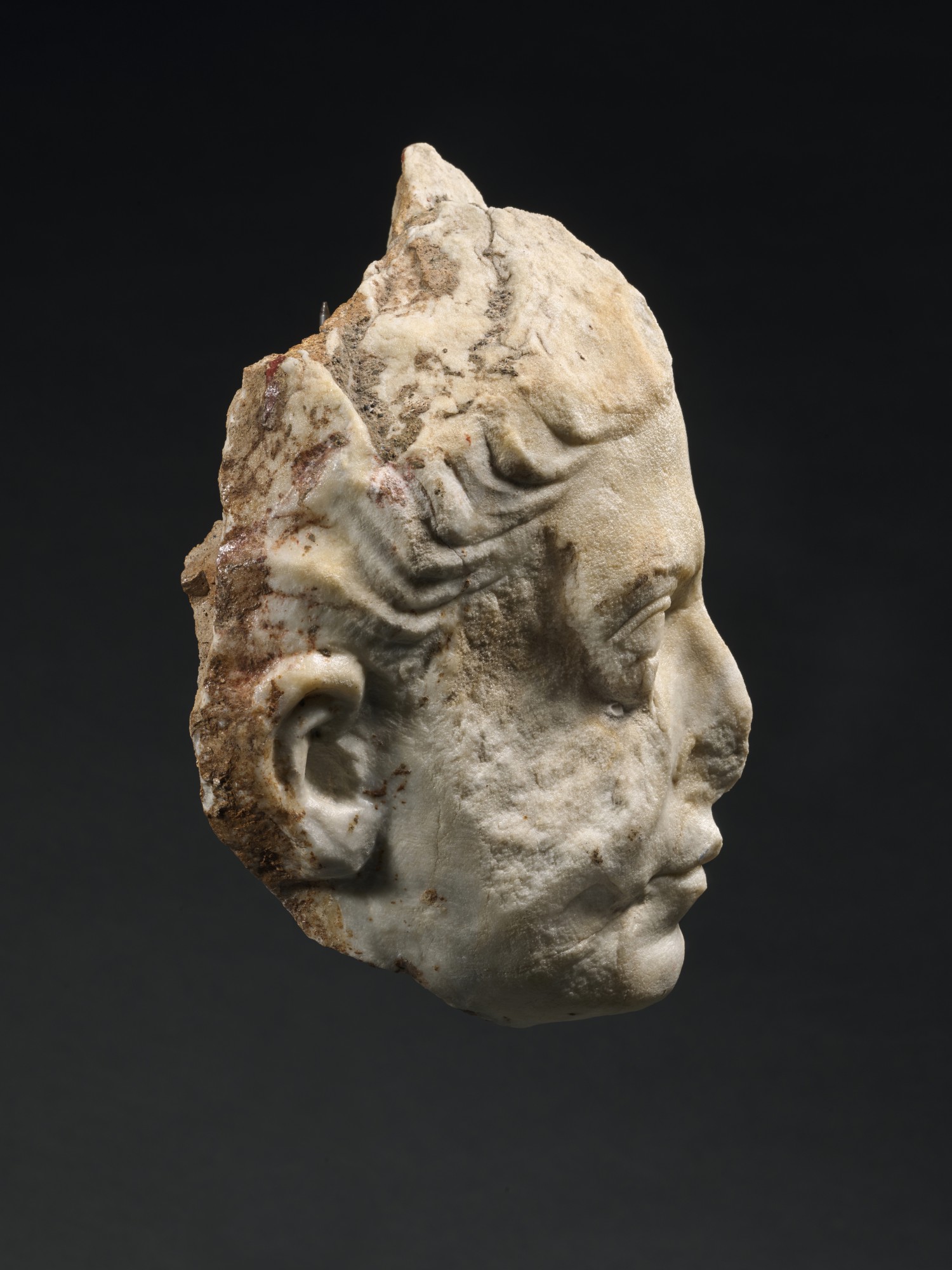 A FRAGMENTARY ROMAN MARBLE PORTRAIT HEAD OF A WOMAN, LATE AUGUSTAN ...