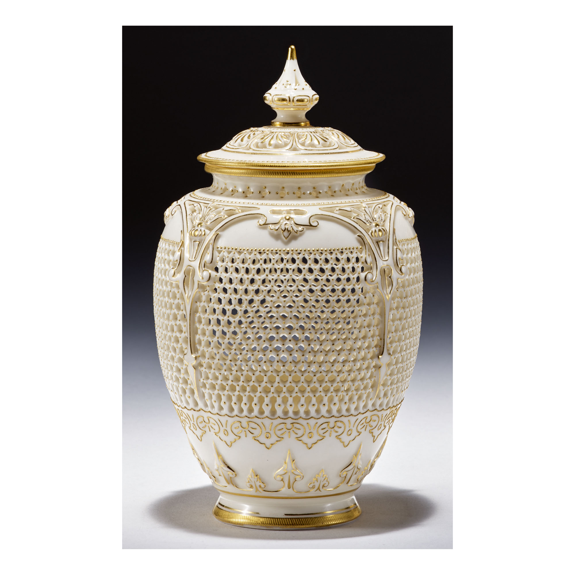 A ROYAL WORCESTER RETICULATED PORCELAIN VASE AND COVER BY GEORGE OWEN ...