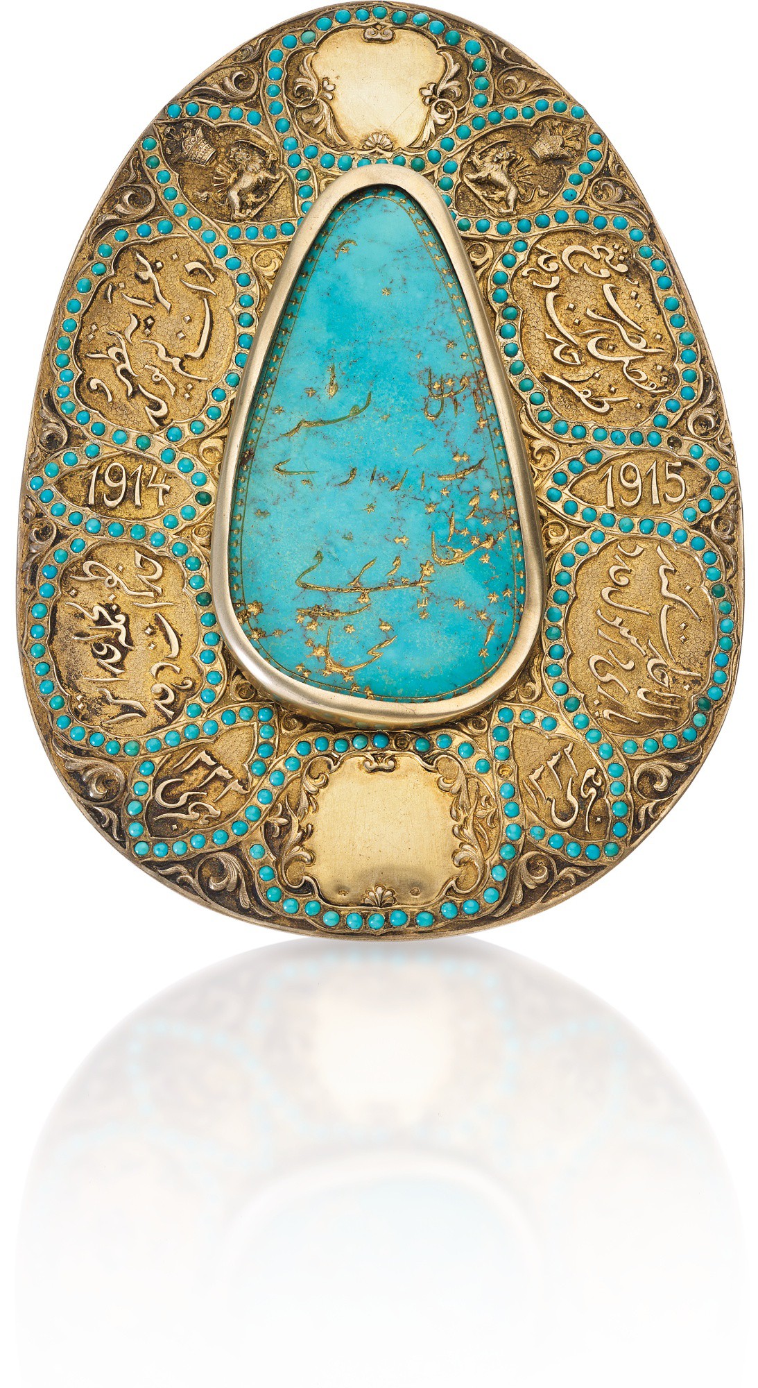 A QAJAR GILT-INSCRIBED TURQUOISE PLAQUE AND BRASS FRAME, PERSIA, DATED ...