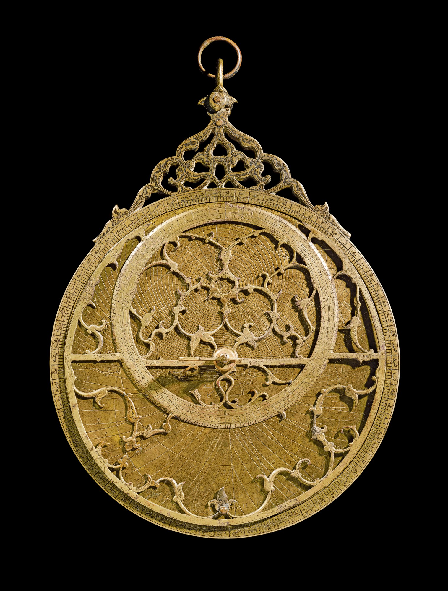 A large royal Mughal planispheric brass astrolabe, signed by Diya' al ...