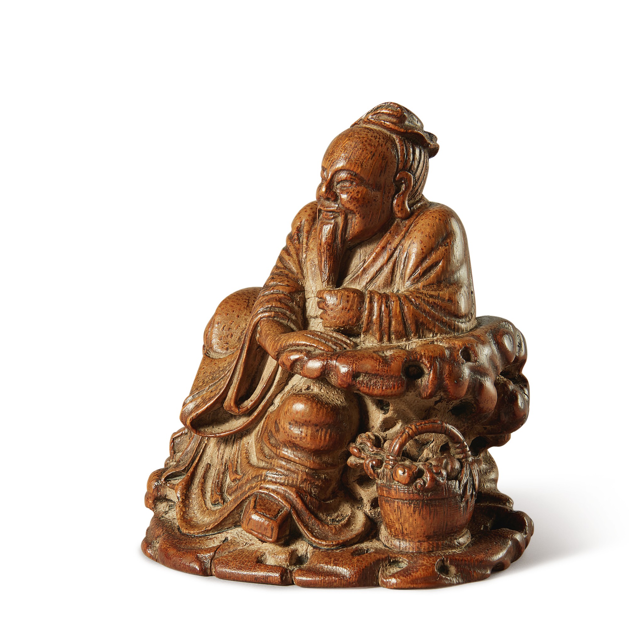 AN INSCRIBED BAMBOO-ROOT FIGURE OF A DAOIST IMMORTAL, QING DYNASTY ...