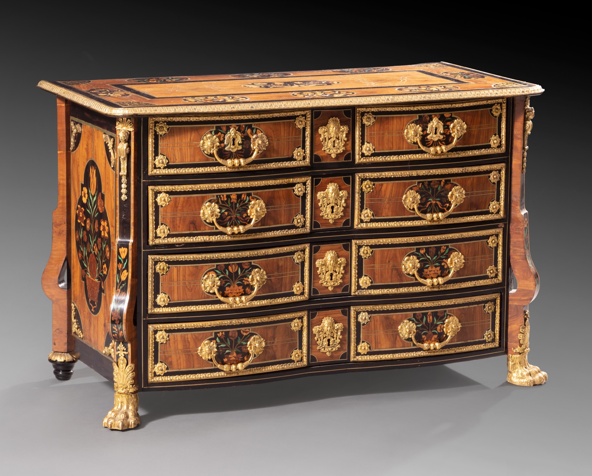 A gilt bronze mounted tinted ivory, fruitwood and ebony marquetry ...