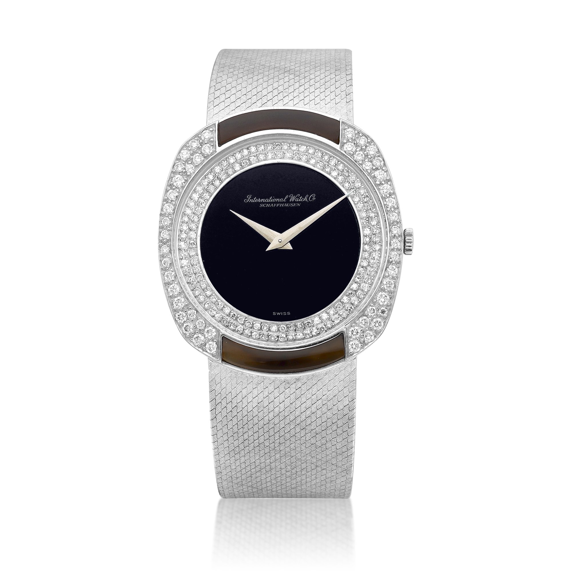 A white gold, diamond and onyx-set bracelet watch with onyx dial, Circa ...