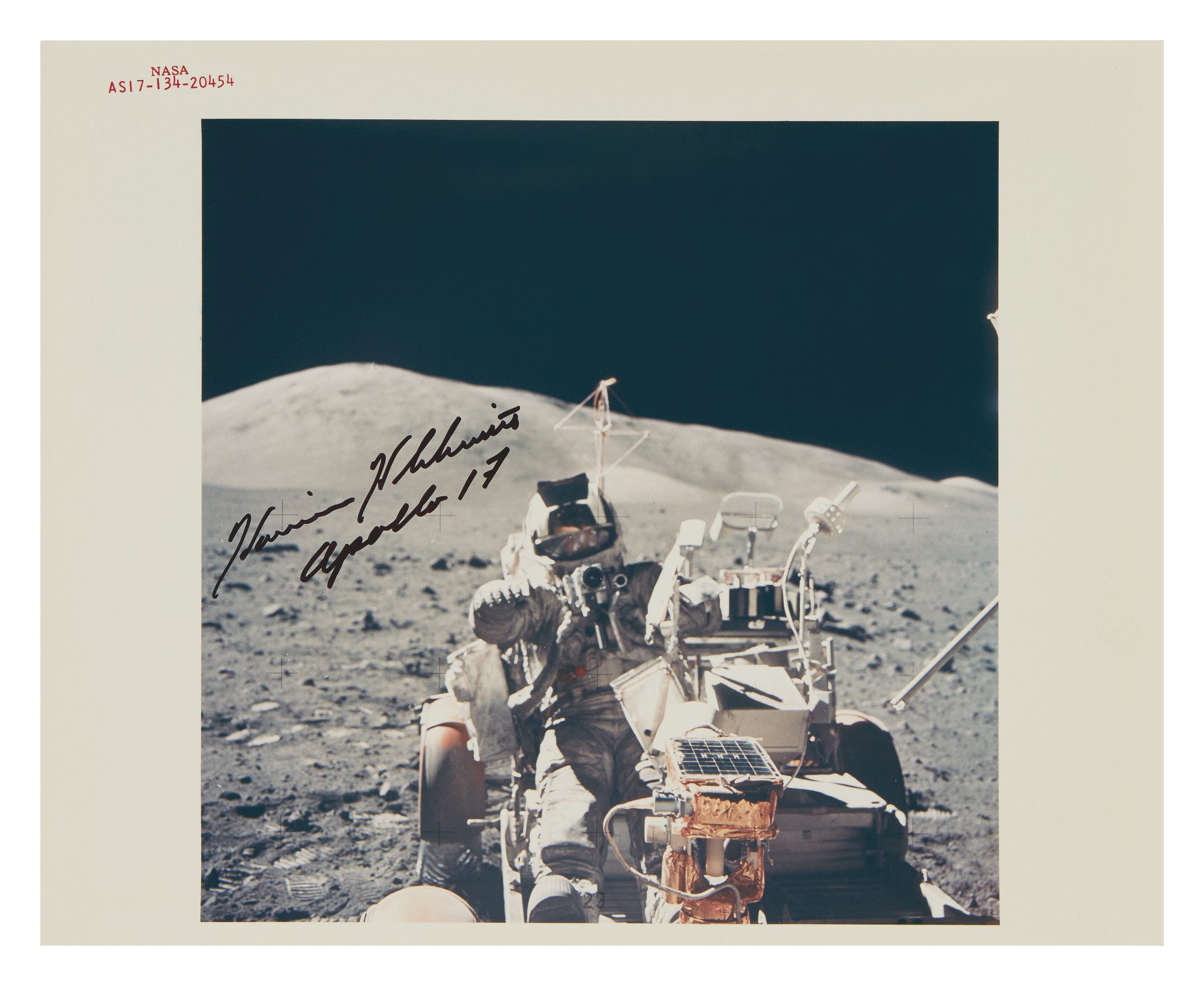 [APOLLO 17] DRIVING THE LUNAR ROVER, INSCRIBED BY SCHMITT. VINTAGE NASA ...
