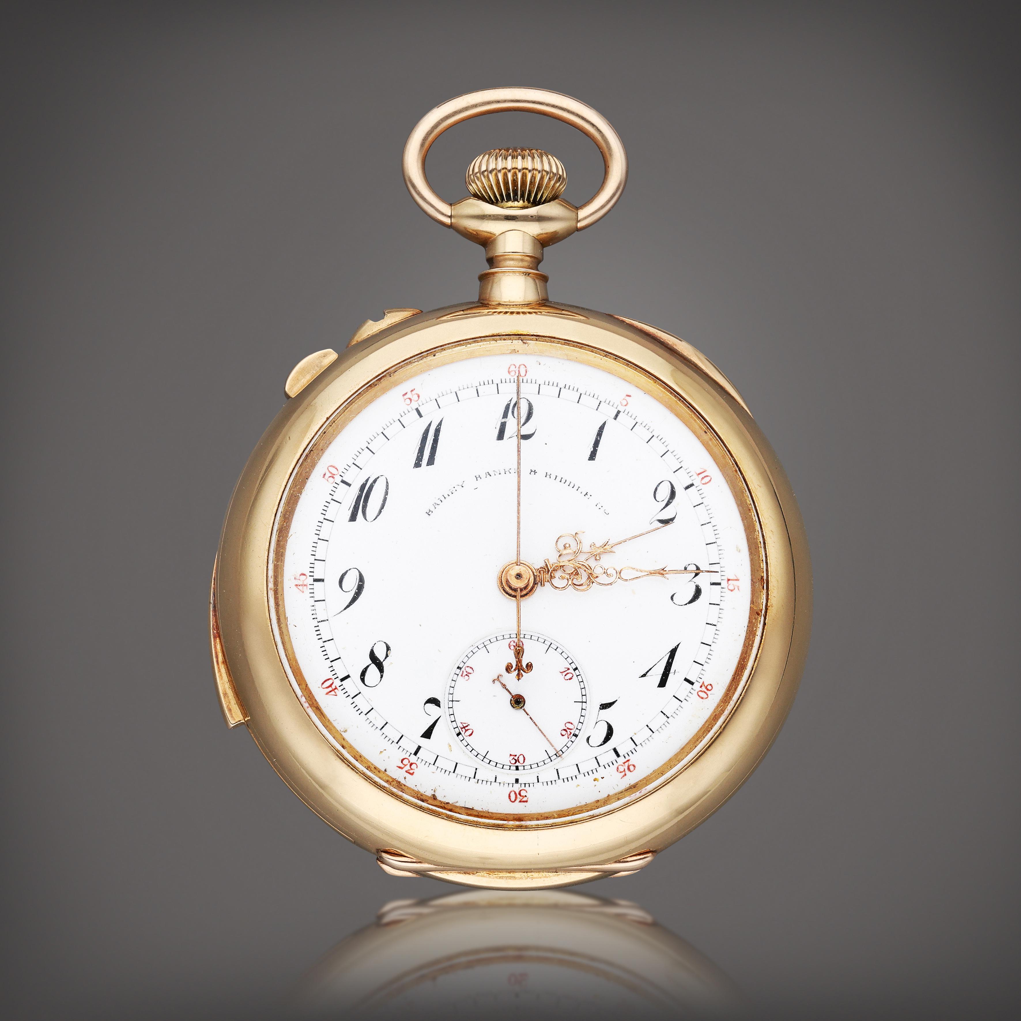 Retailed by Bailey Banks & Biddle Co.: A yellow gold open faced minute ...