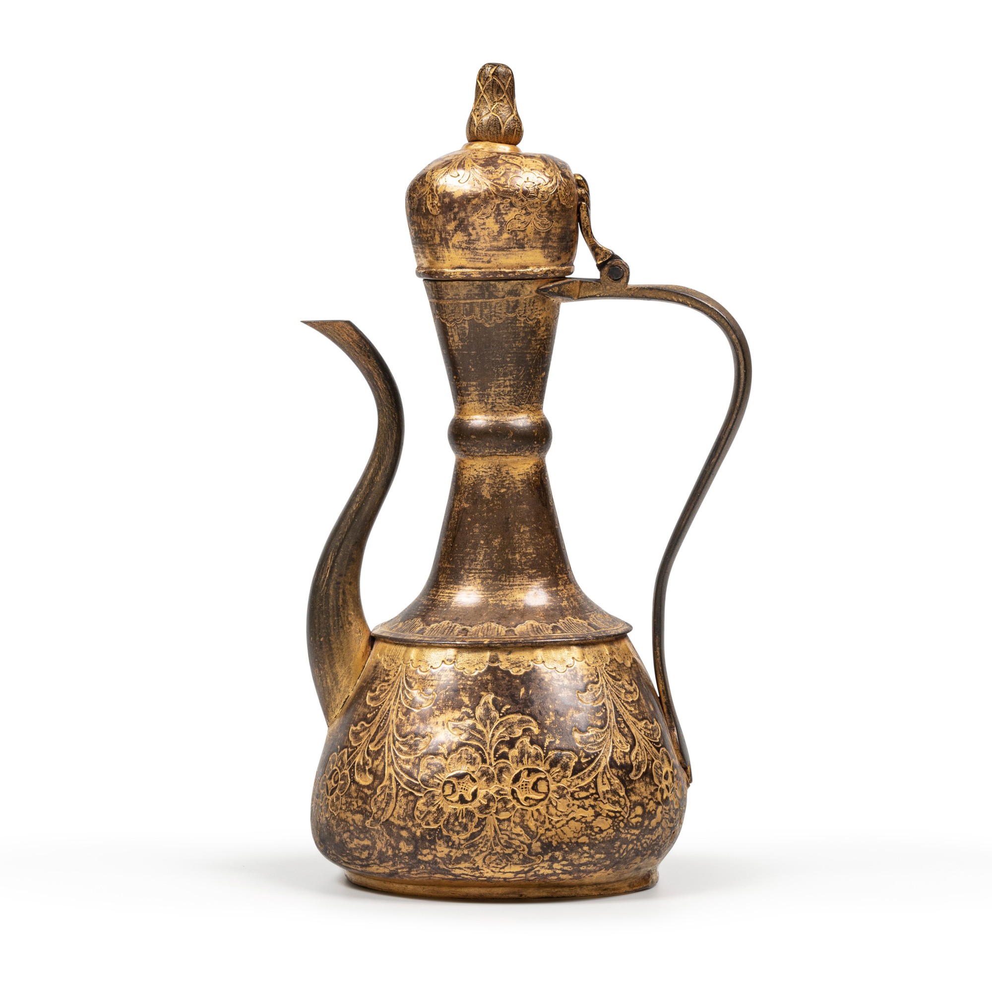An Ottoman gilt-copper (tombak) lidded ewer, with associated basin and ...