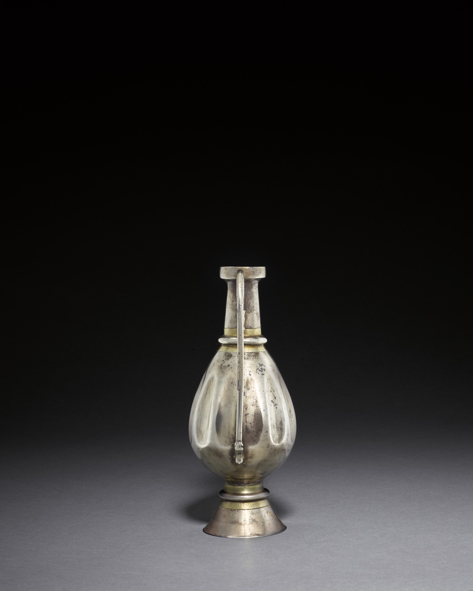 A Sassanian or early Islamic silver ewer with vertical fluting, Persia ...