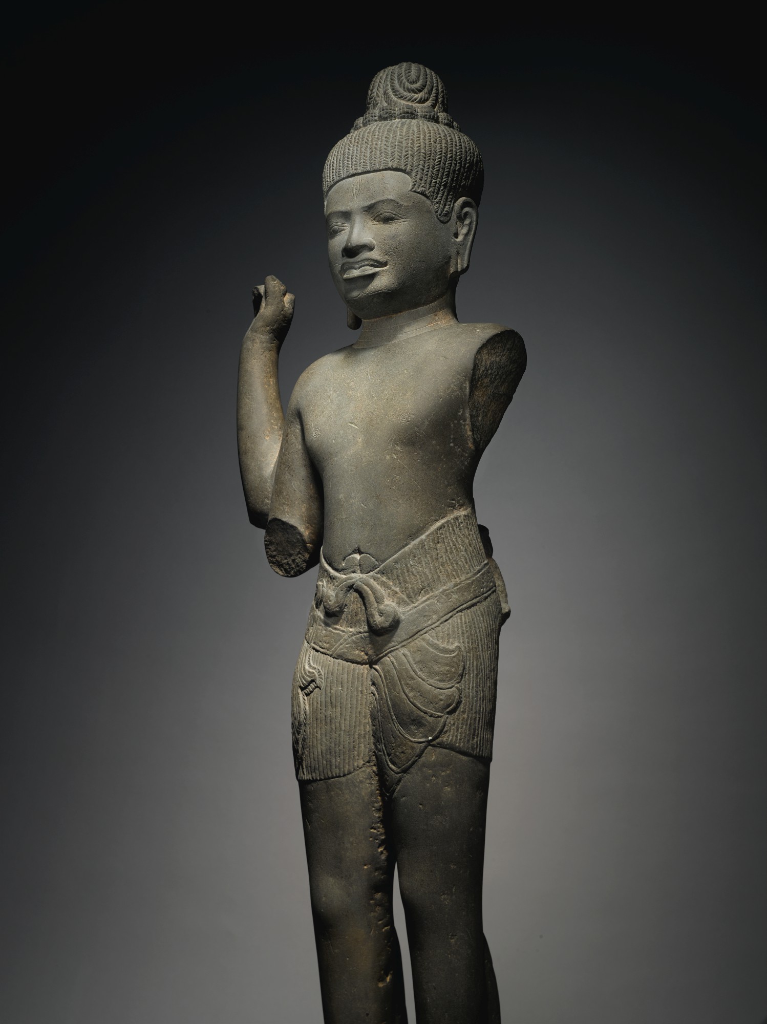 A GREY SANDSTONE FIGURE OF SHIVA, KHMER, BAPHUON STYLE, CIRCA 11TH ...