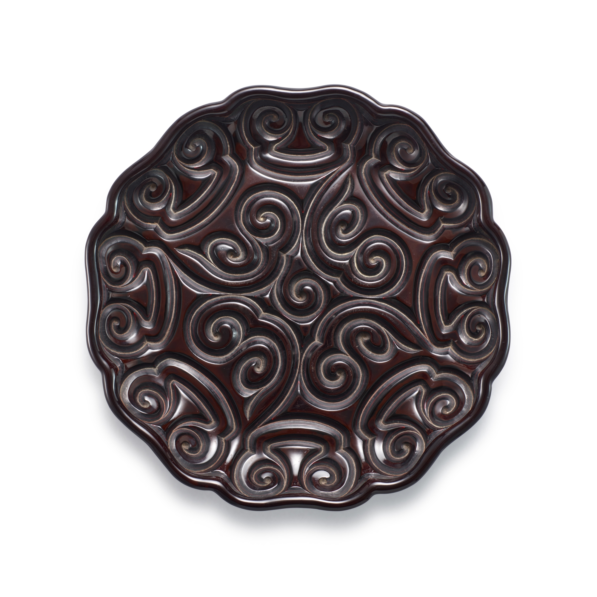 An extremely rare and finely carved black 'tixi' lacquer lobed dish ...