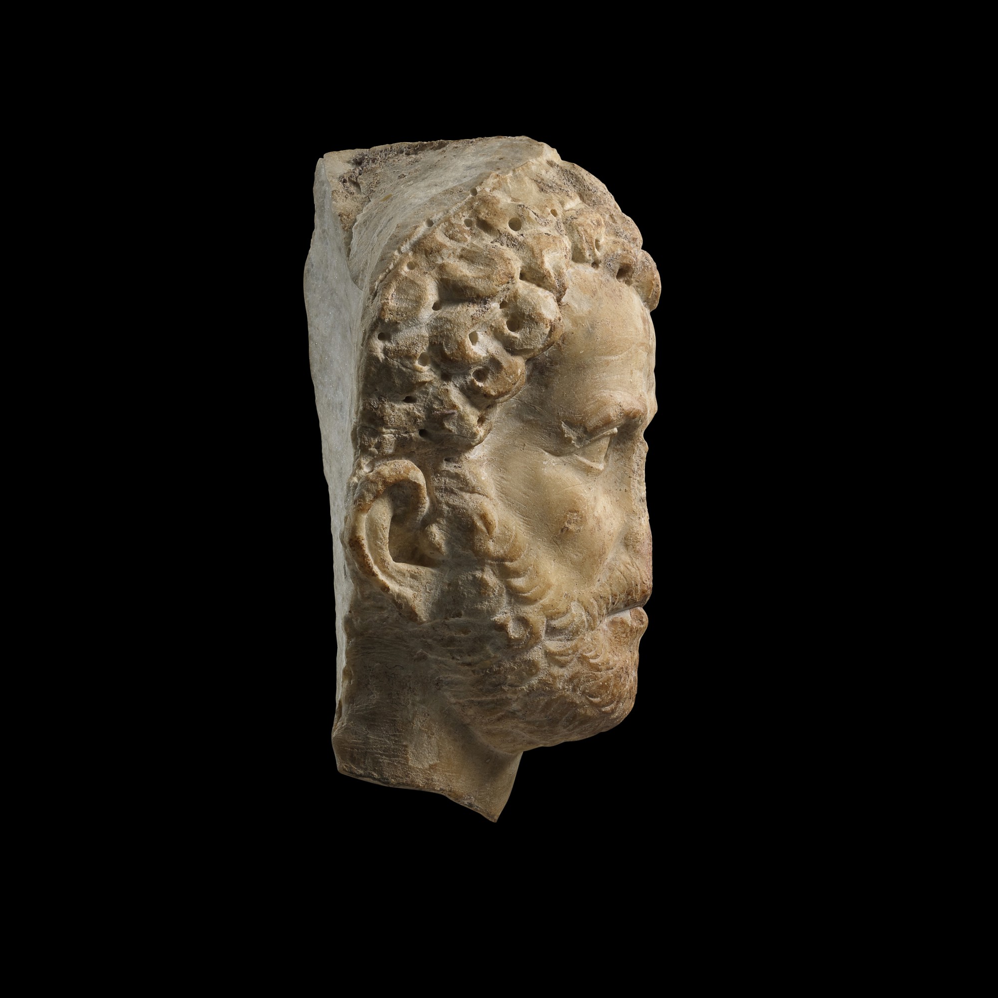A ROMAN MARBLE RELIEF PORTRAIT HEAD OF A MAN, ANTONINE, PROBABLY ...