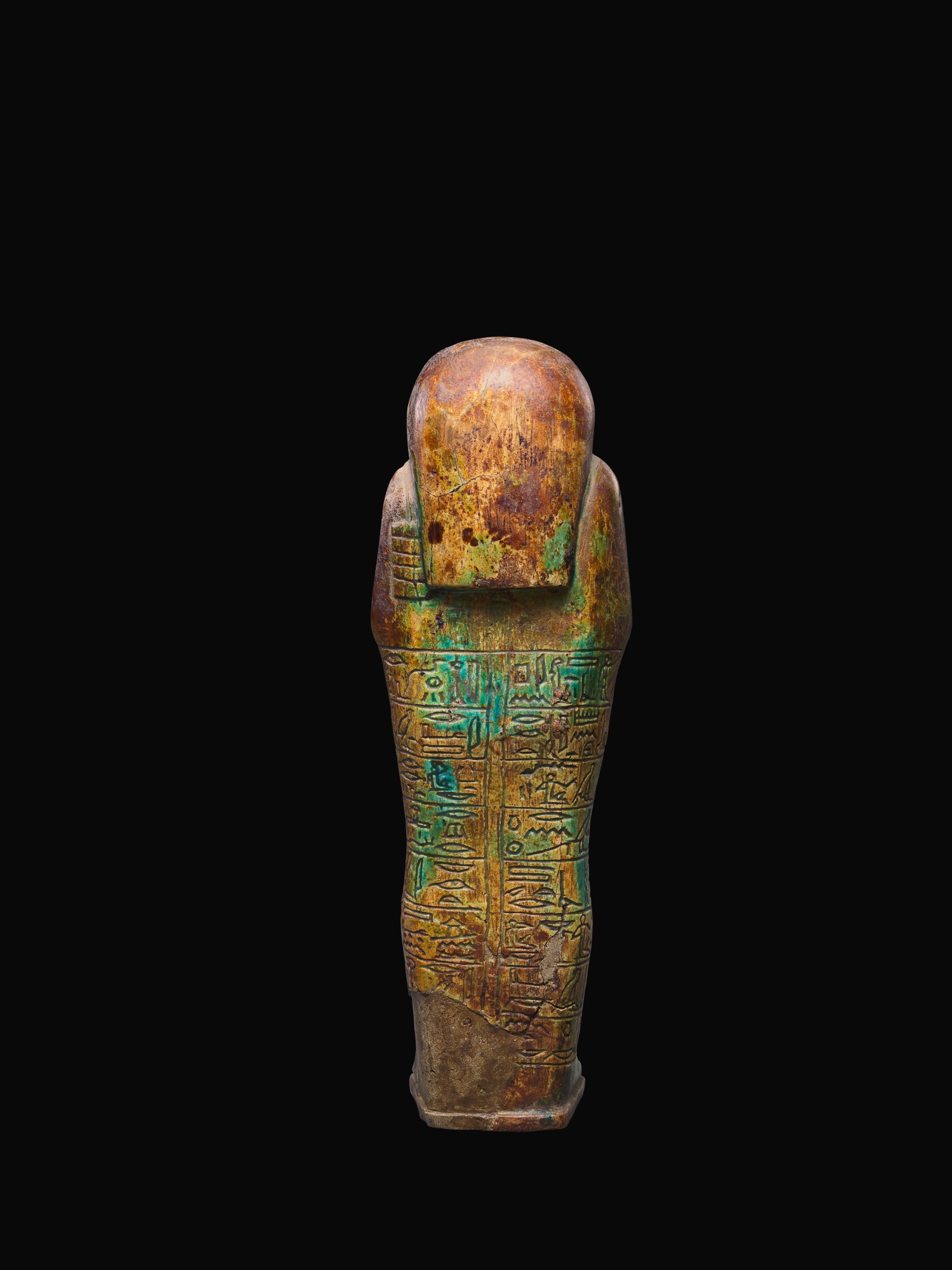 AN EGYPTIAN BLUE-GREEN GLAZED STEATITE USHABTI OF THE CHIEF LECTOR ...