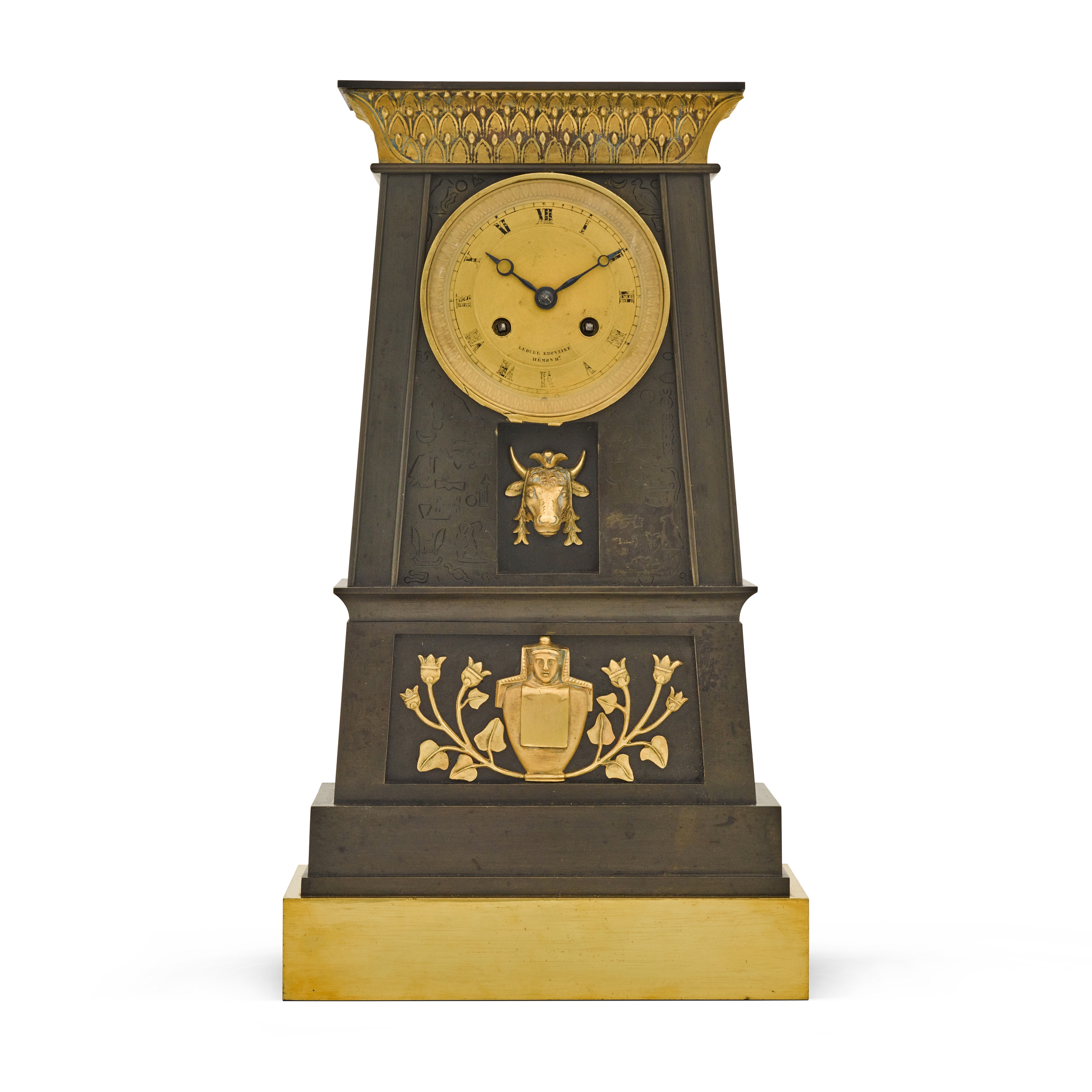 An Empire gilt and patinated bronze Egyptian revival mantel clock ...