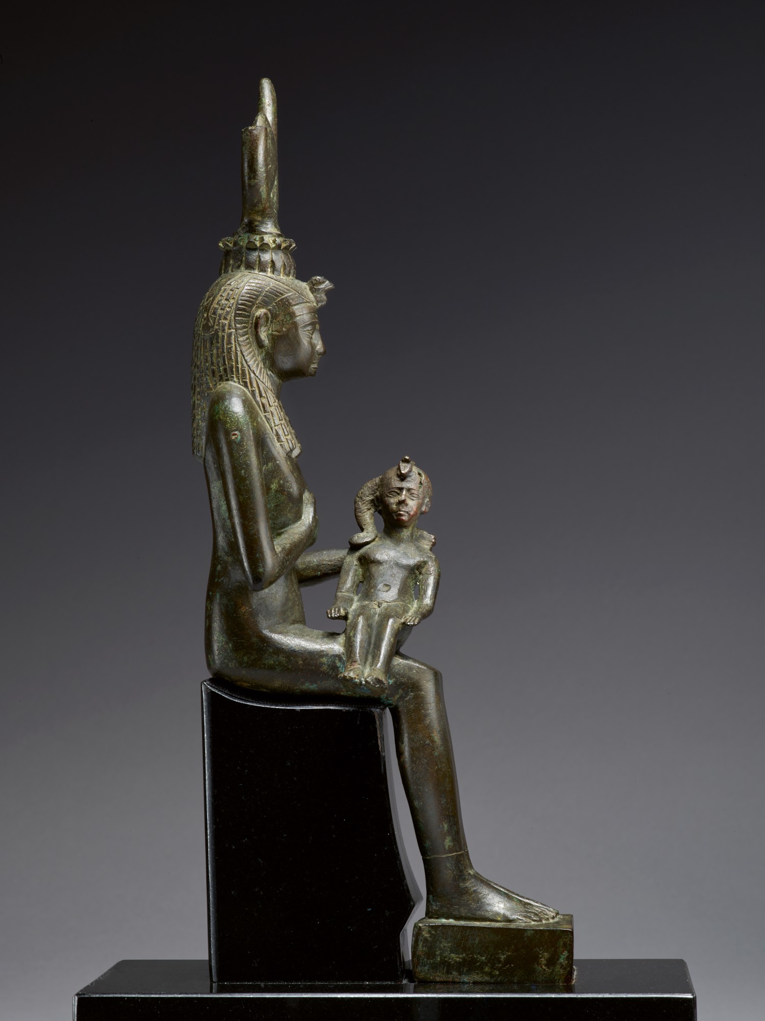 An Egyptian Bronze Figure of Isis with Horus, 26th Dynasty, 664-525 B.C ...