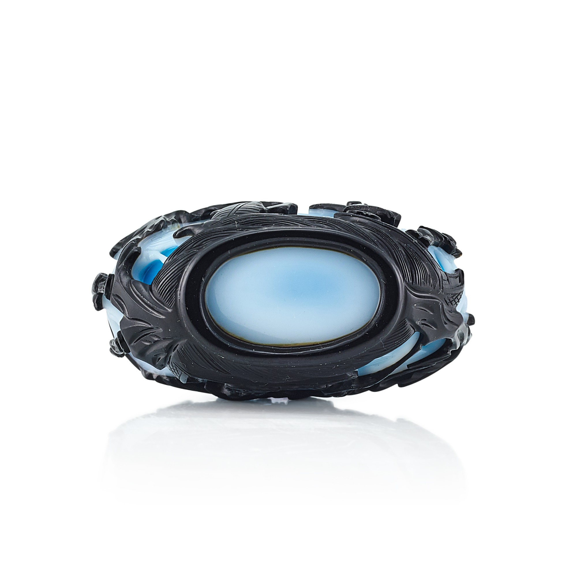 A Black and White Double-Overlay Turquoise-Blue Glass 'Figures and ...
