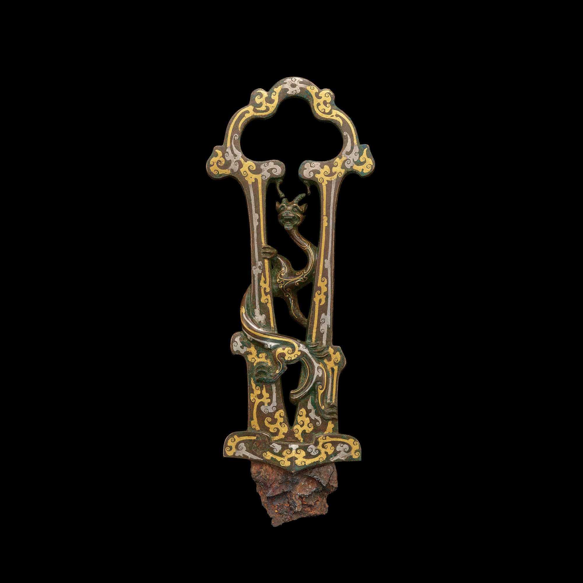 An exceptional and rare gold and silver-inlaid bronze sword hilt, Late ...