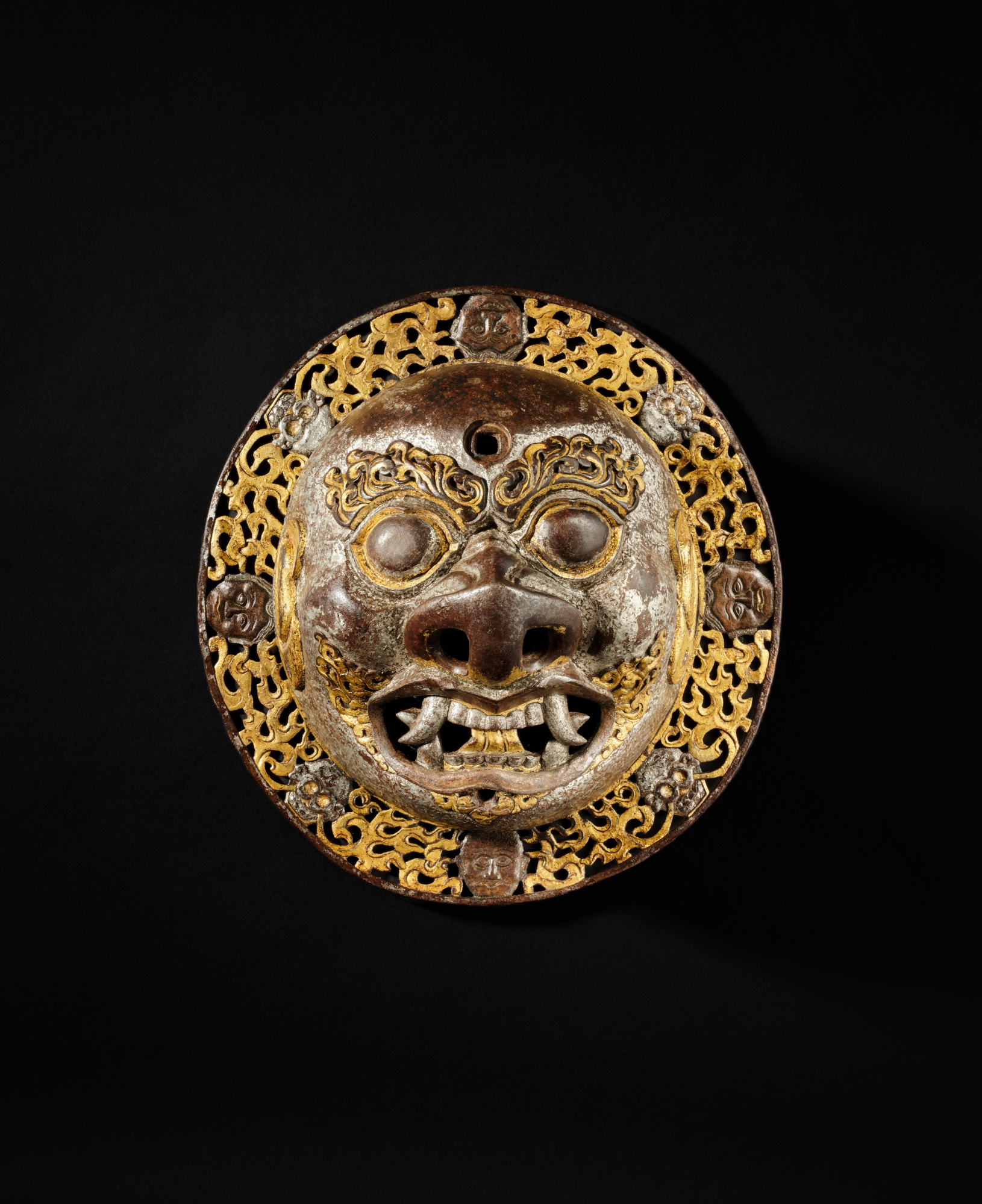 A pair of large gold, silver and copper overlaid iron door bosses ...