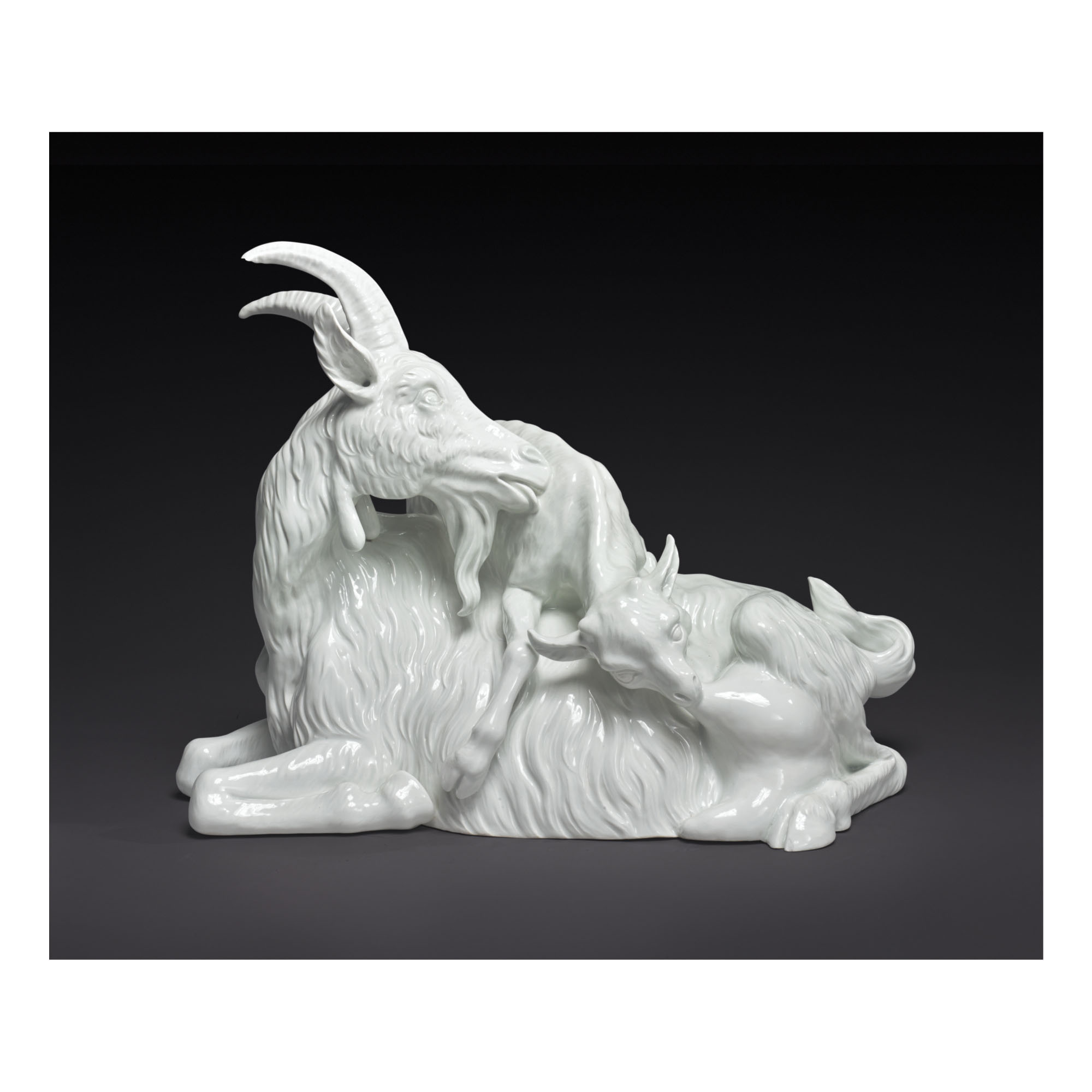 A MEISSEN LARGE WHITE FIGURE OF A NANNY-GOAT WITH KID (CAPRA) 20TH ...
