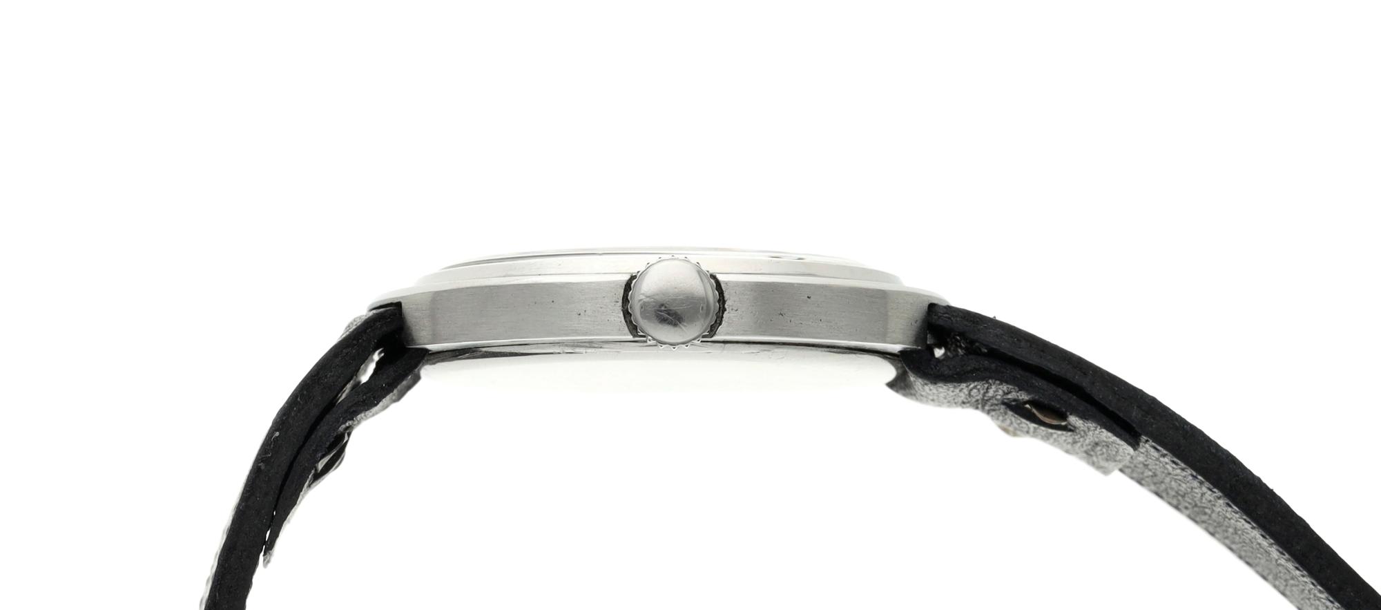 Disco Volante, An oversized stainless steel wristwatch with gilt dial ...