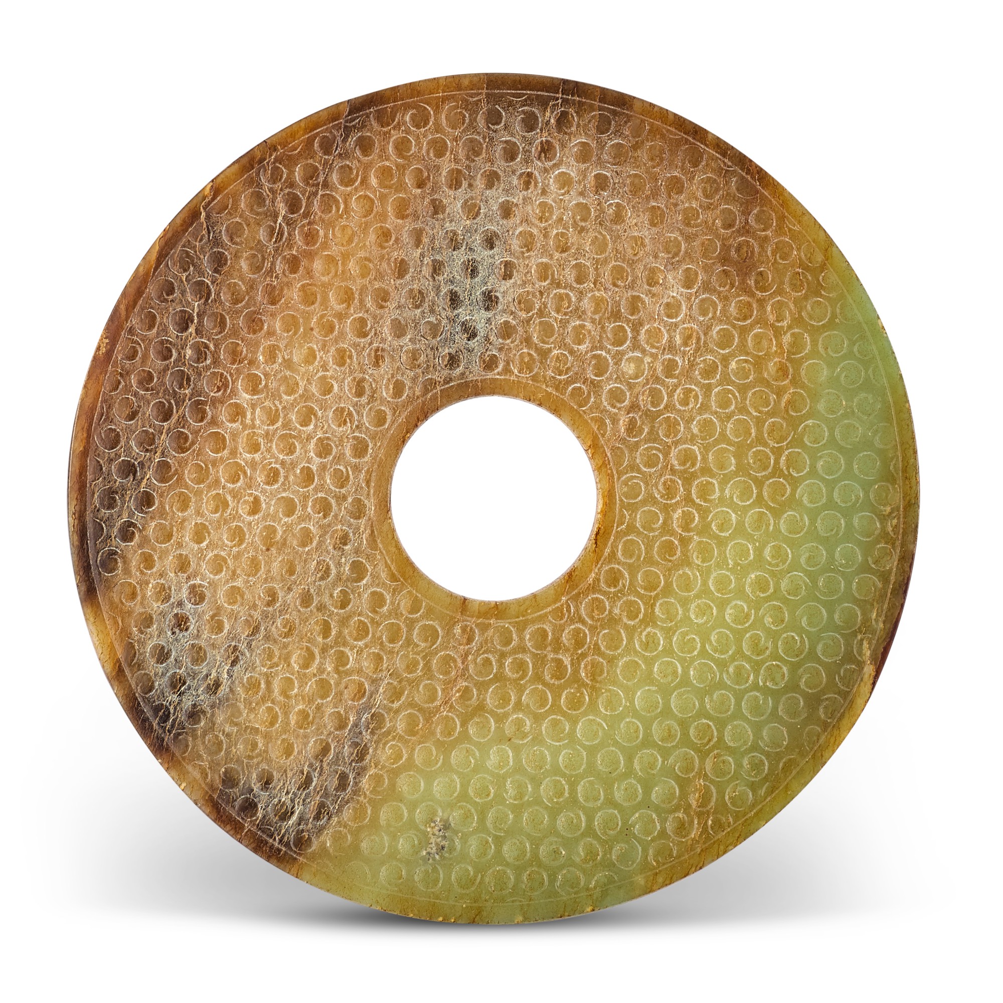 A celadon and russet jade disc, bi Eastern Zhou dynasty, Warring States ...