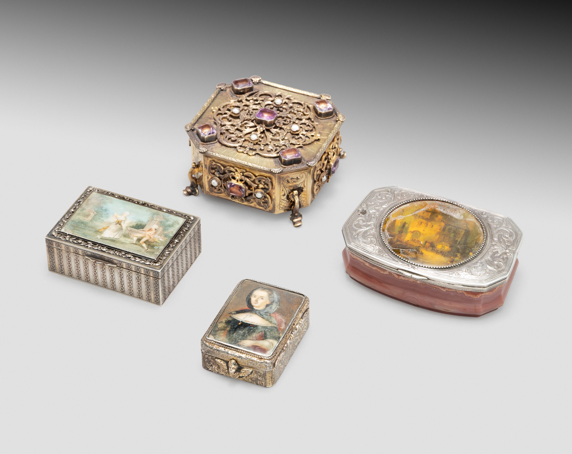 A group of three silver and silver-gilt boxes, and one silver-plated ...